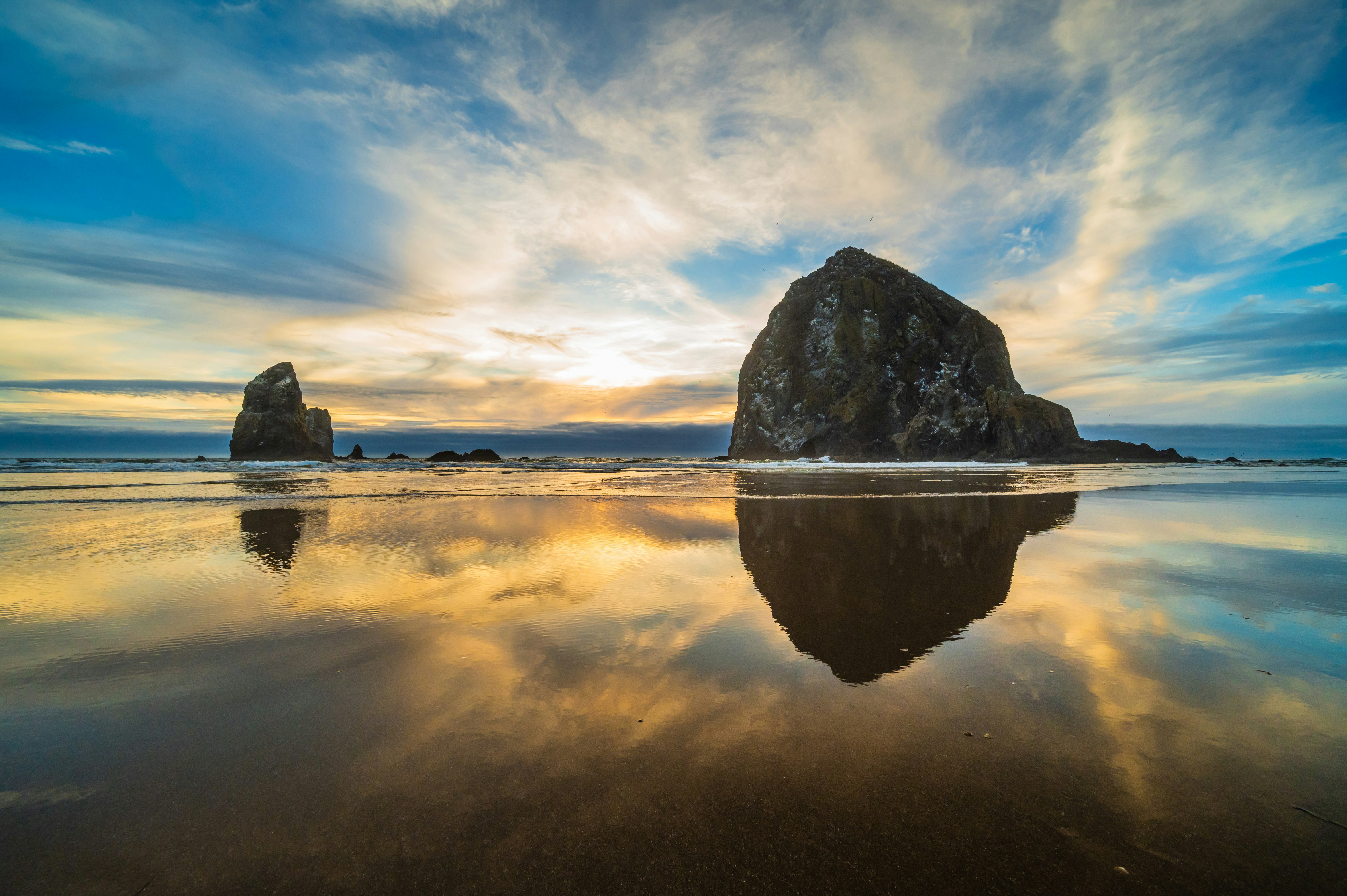 Personal opinion: the magic of Haystack Rock is in the crystal clear reflections in wet sand.