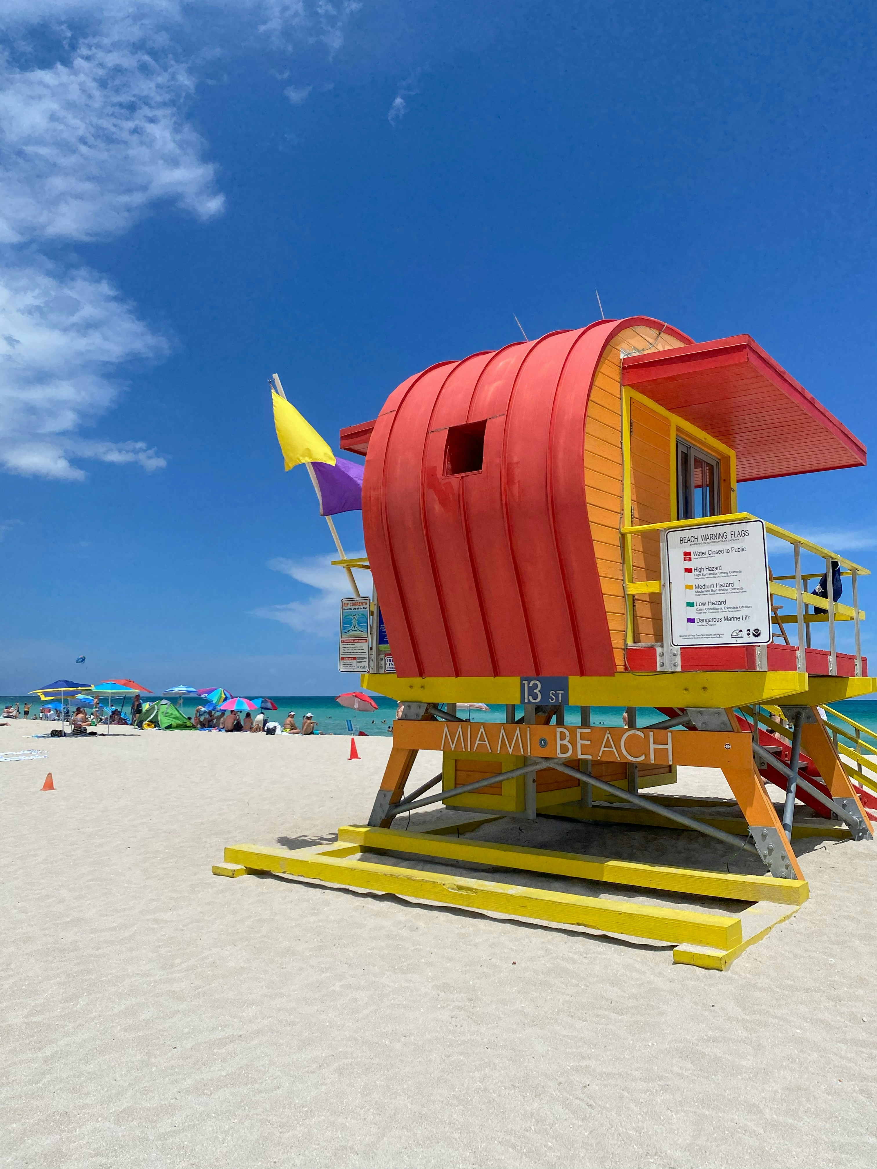 A lifeguard stand on the beach with a lifeguard flag photo – Free Beach ...