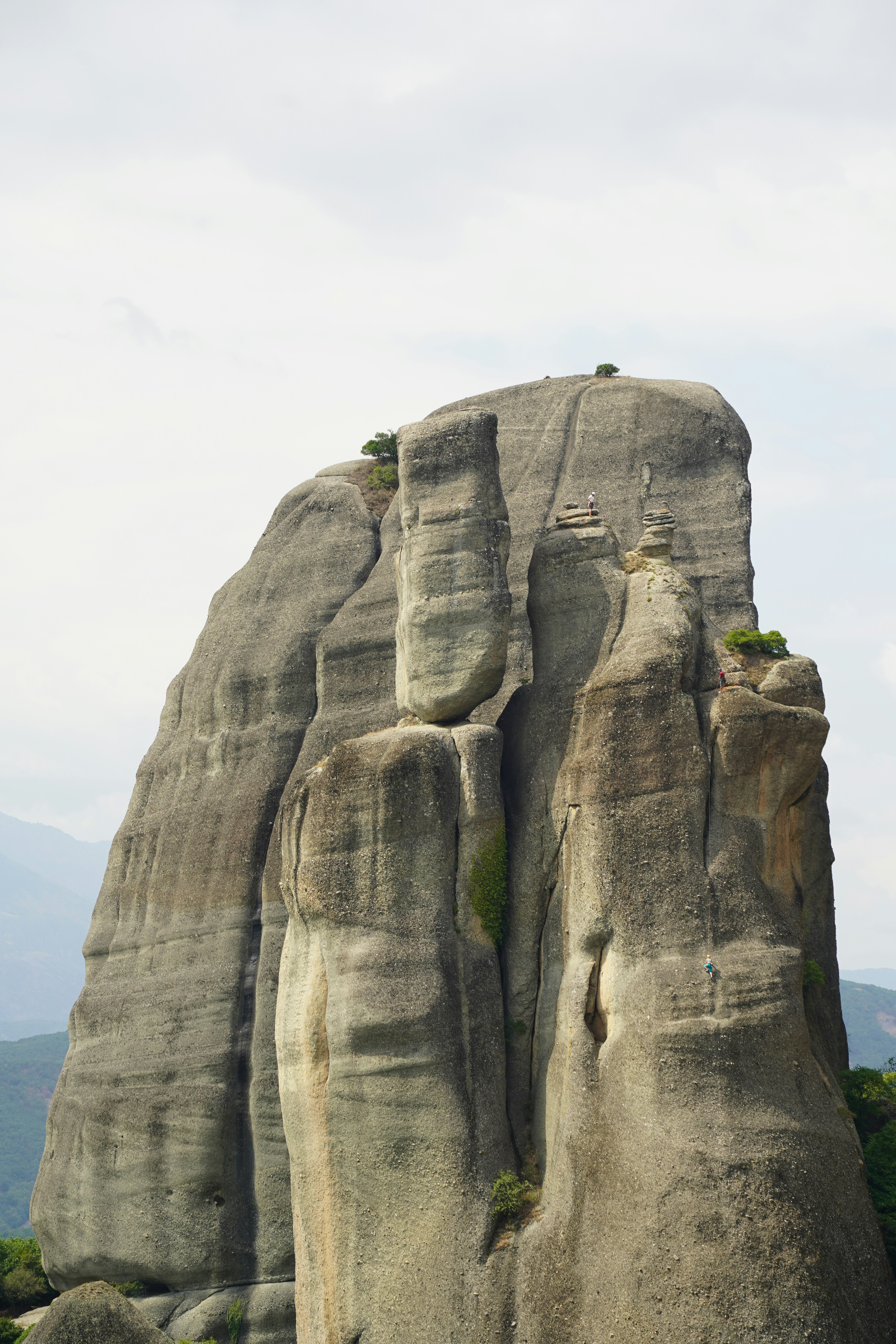 A large rock formation in the middle of a field photo – Free Woman ...