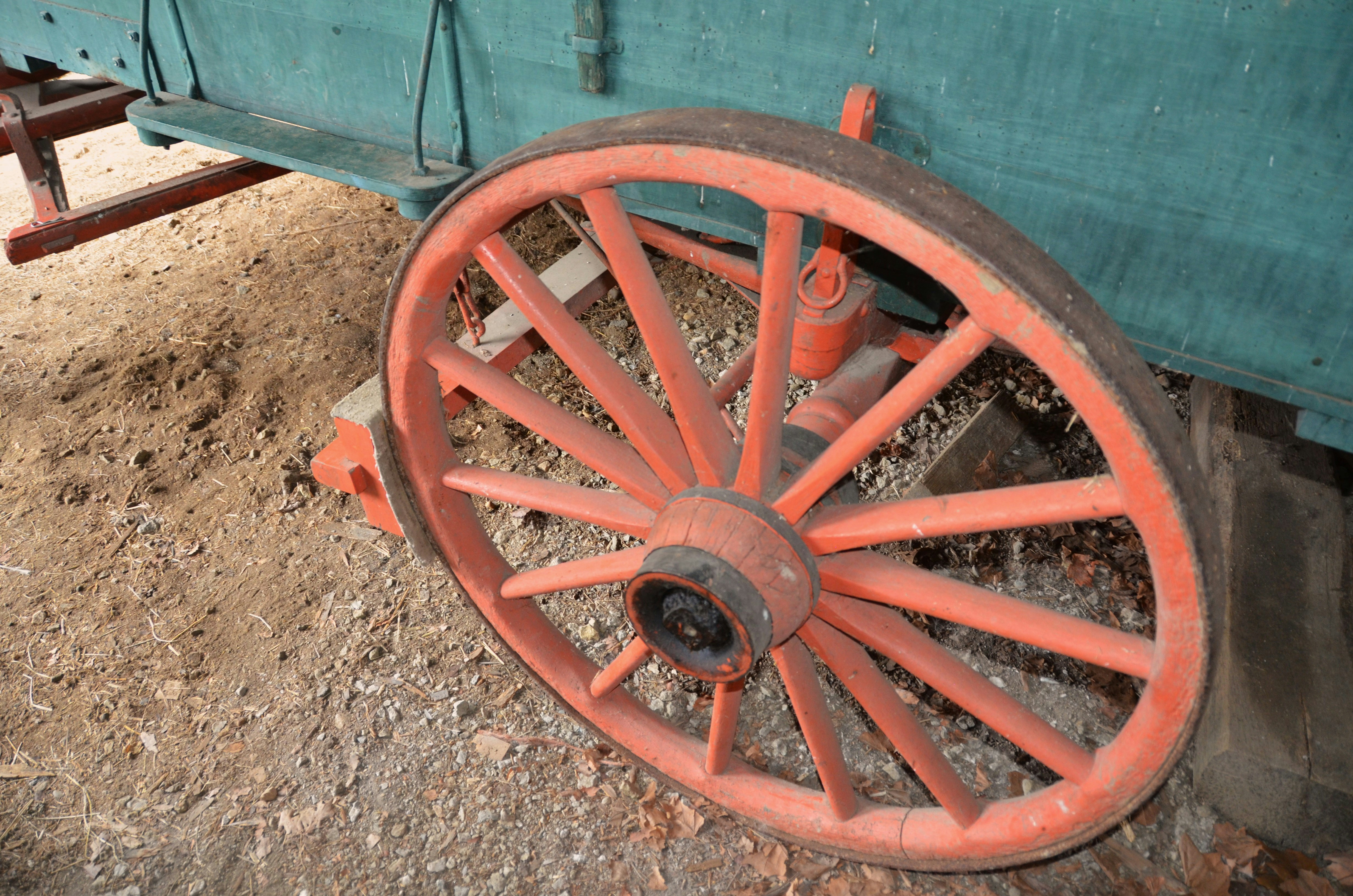 Red Wheel of Time: A Vintage Wagon's Weathered Spokes