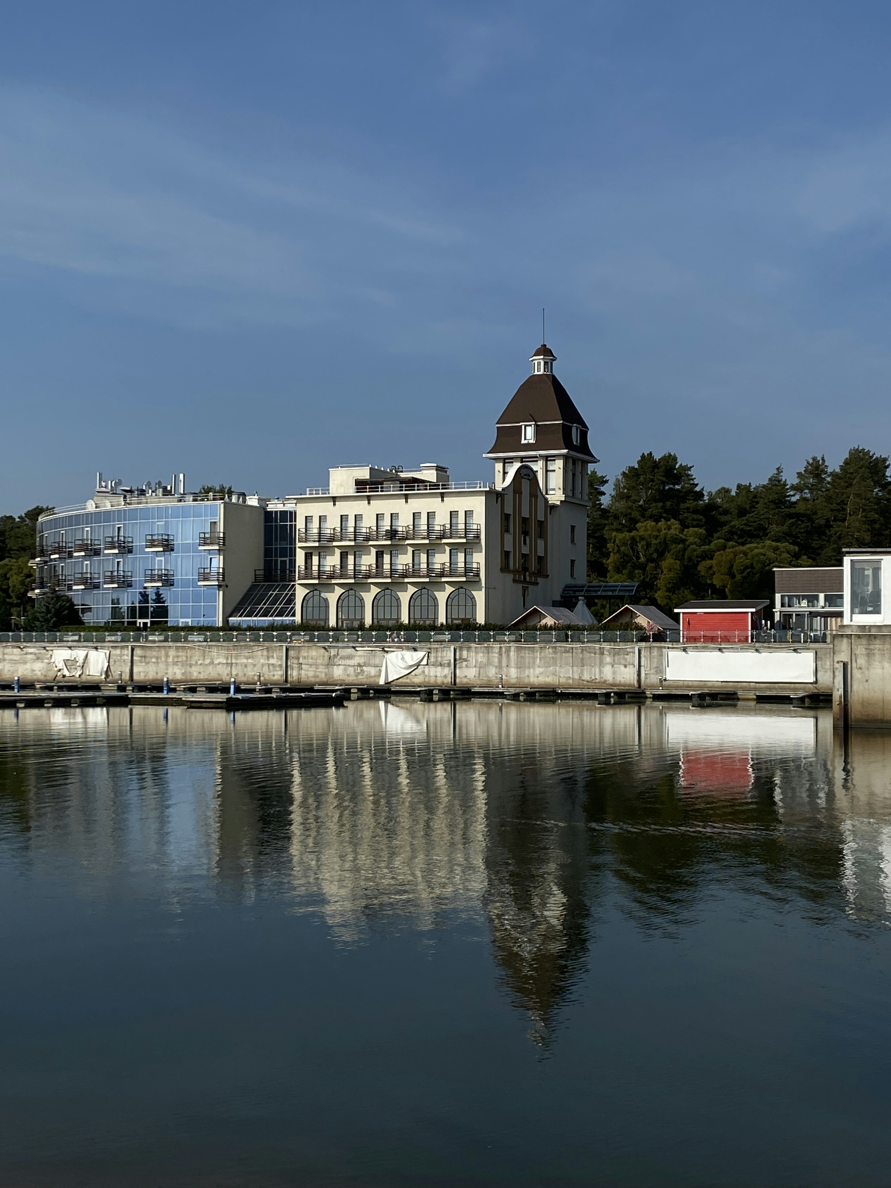 Harborfront Clocktower: Quiet Reflections on a Sunlit Pier