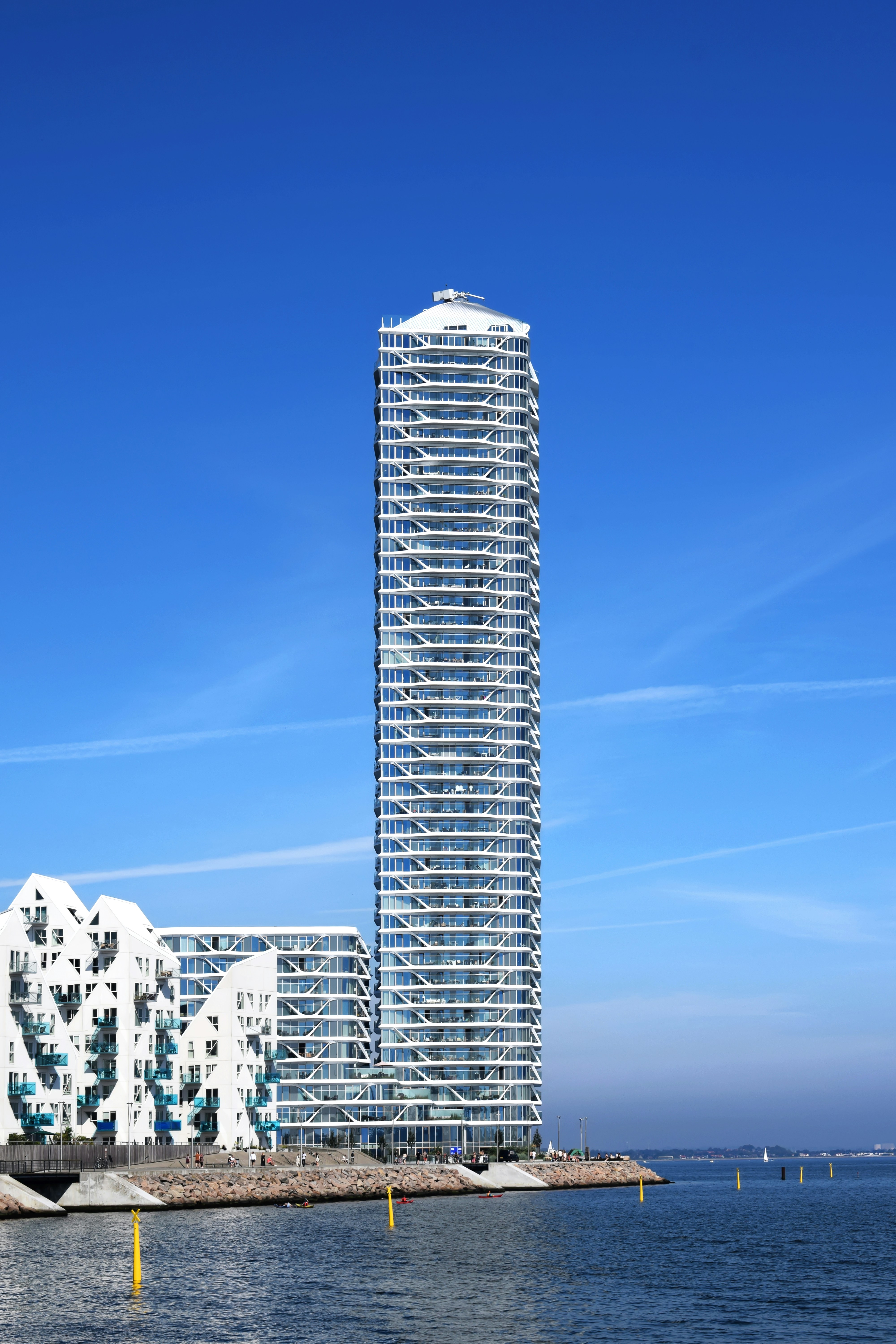 Azure Colossus by the Sea: A Balconied White Spire
