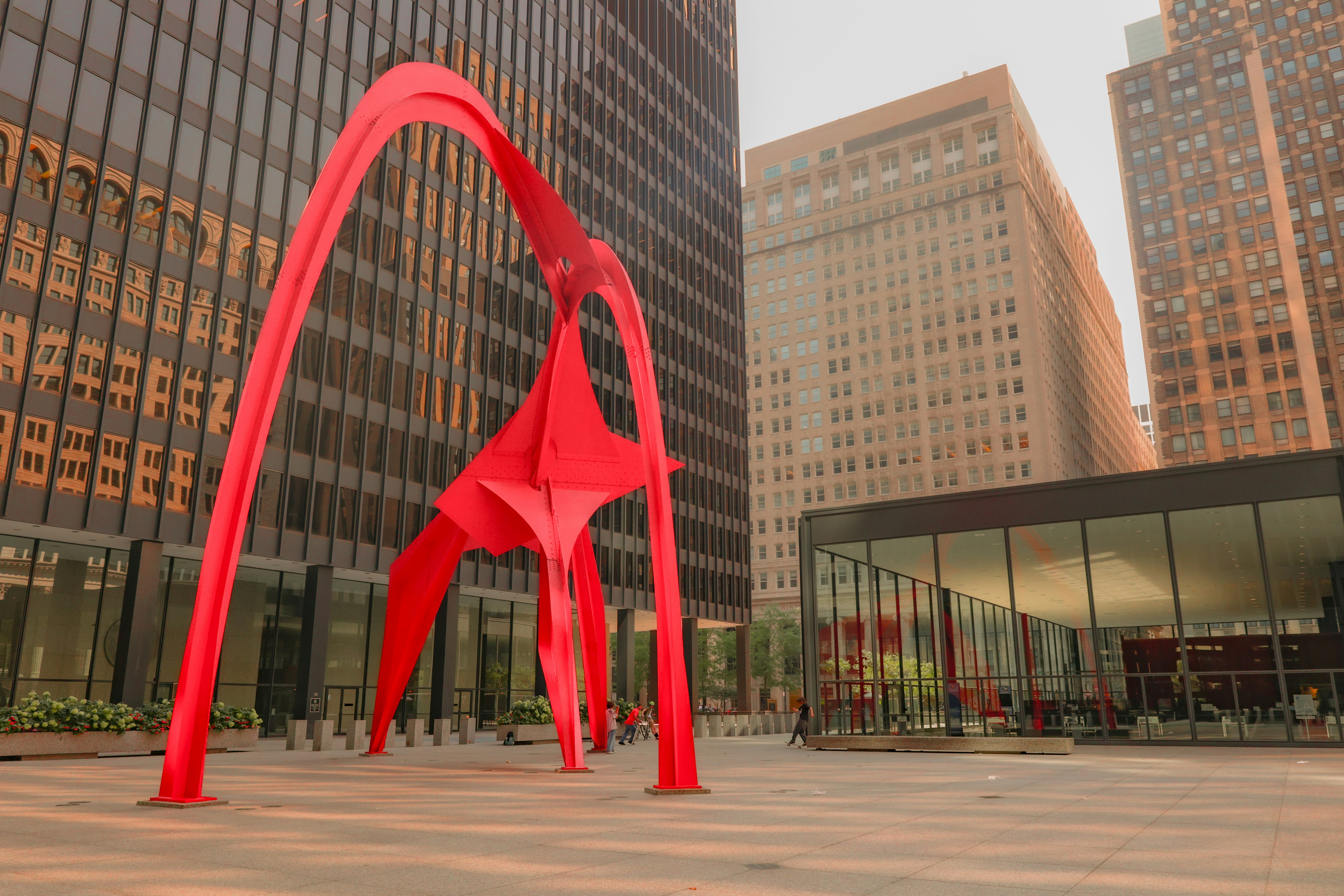 A large red sculpture in front of a tall building photo – Free Chicago ...