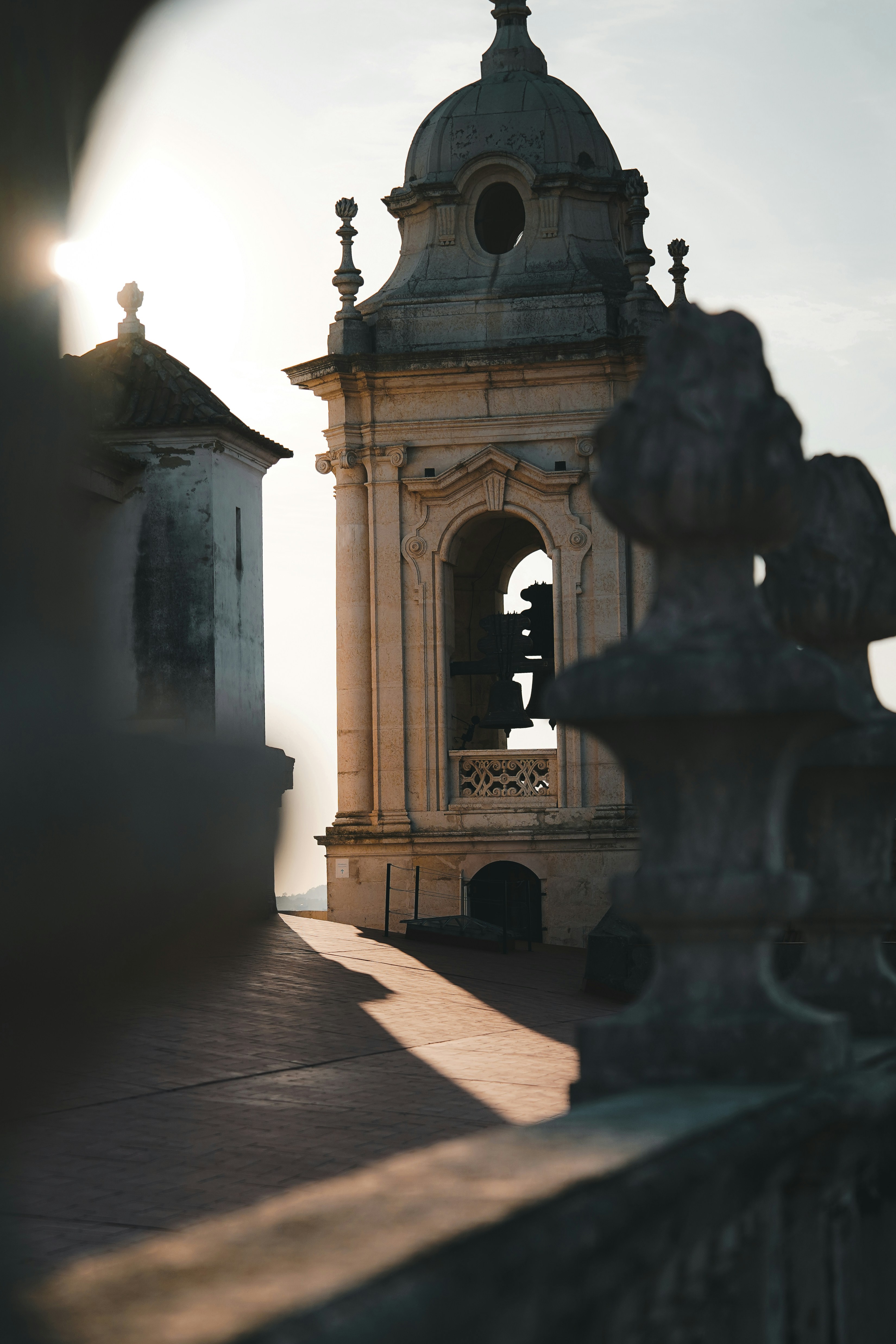 Dawn over the Bell Tower: Warm Stone and Silent Parapets