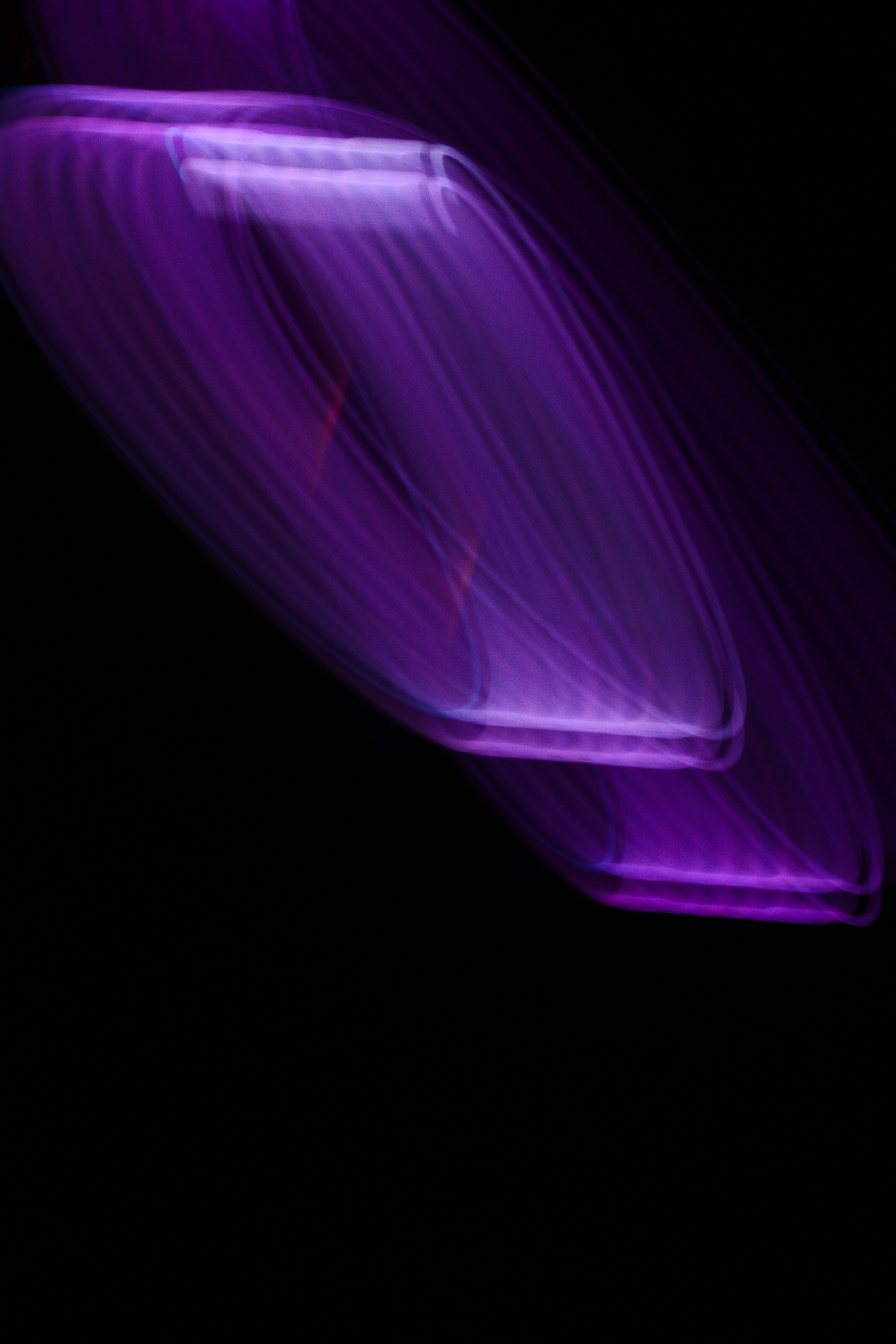 A cell phone with a blurry image of a purple object photo – Free Purple ...