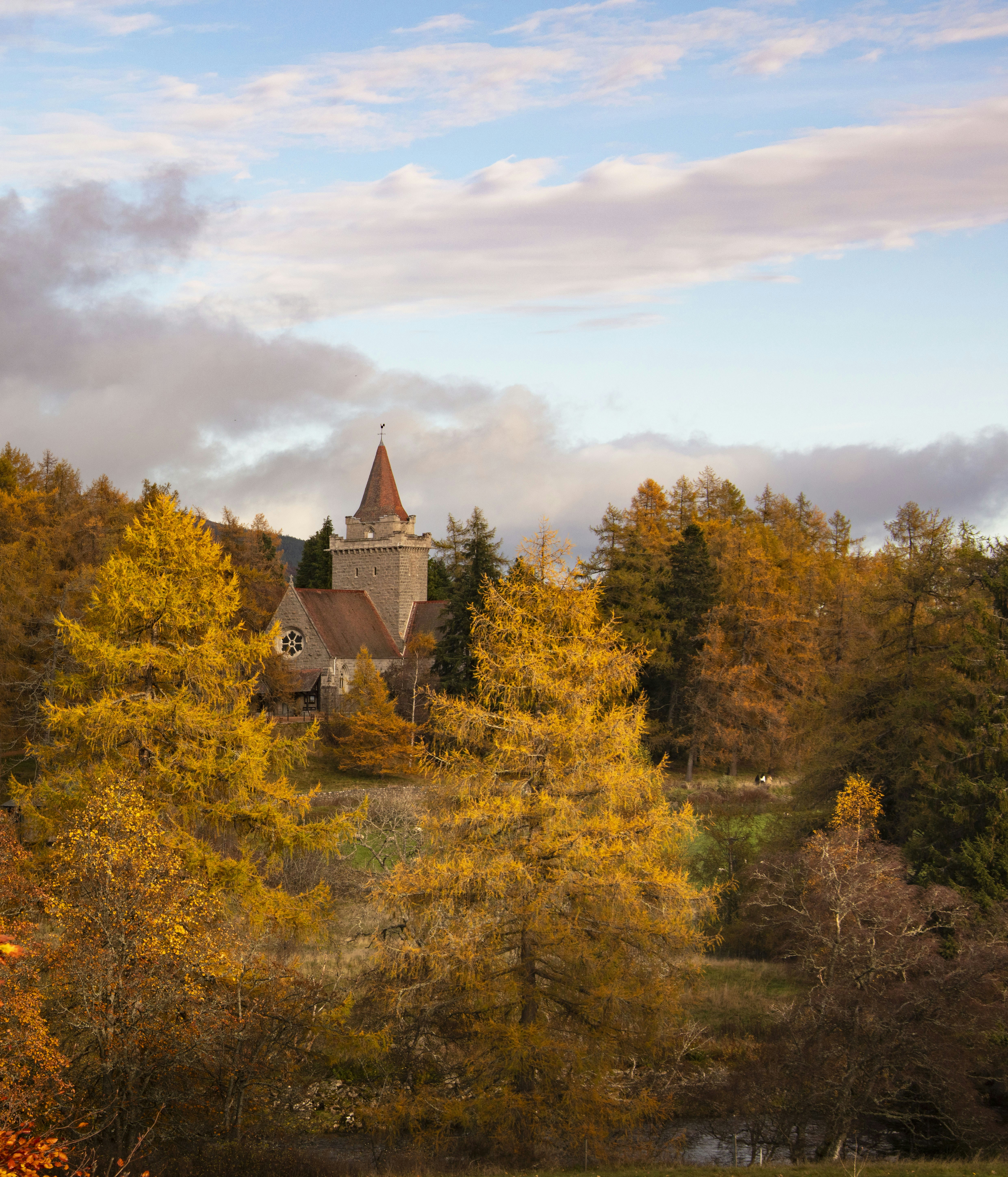 Hilltop Chapel Embraced by Autumn Gold Among Pines