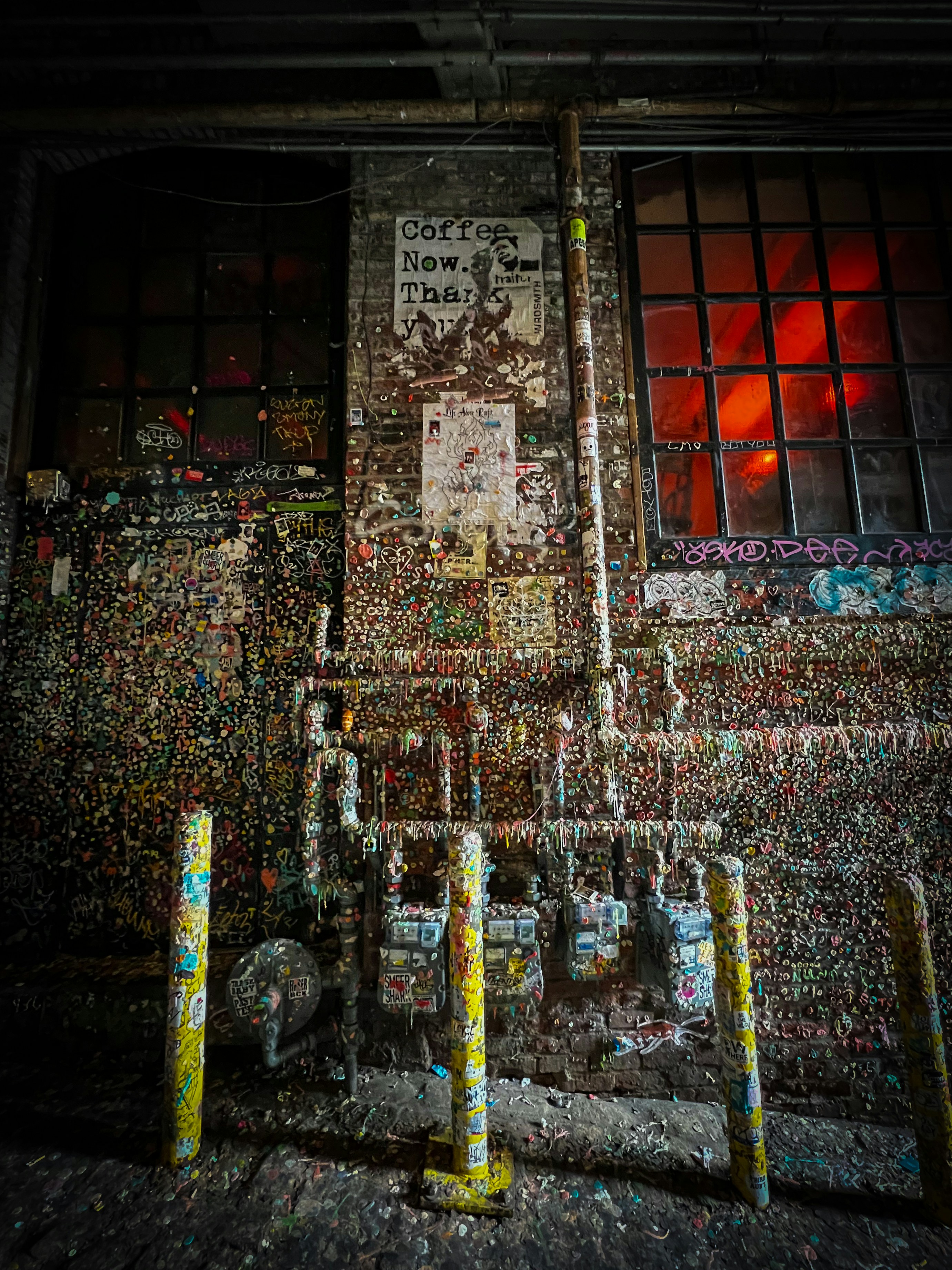A fire hydrant in front of a building covered in graffiti photo – Free ...