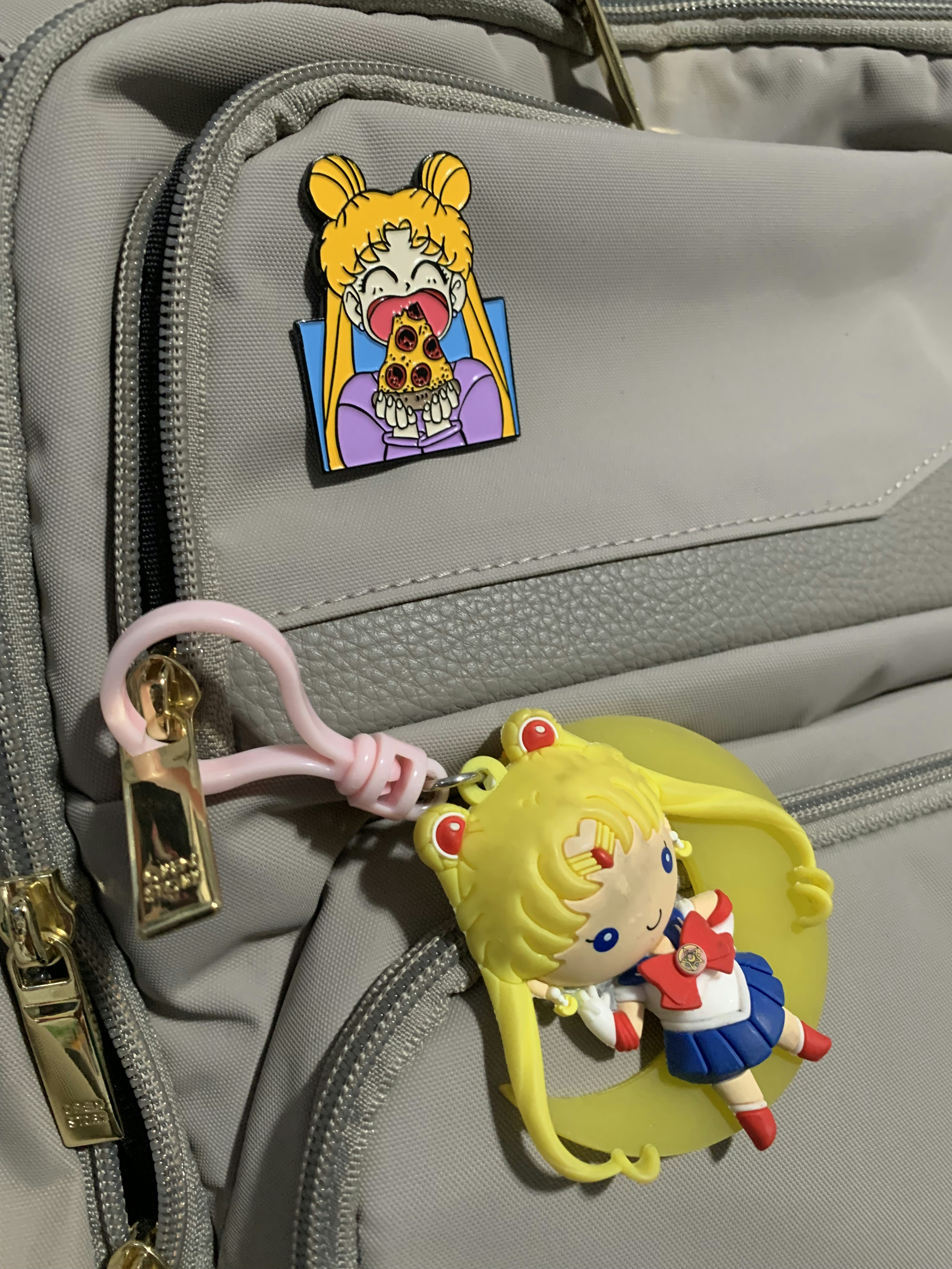 A little girl keychain attached to a backpack photo – Free Bag Image on ...