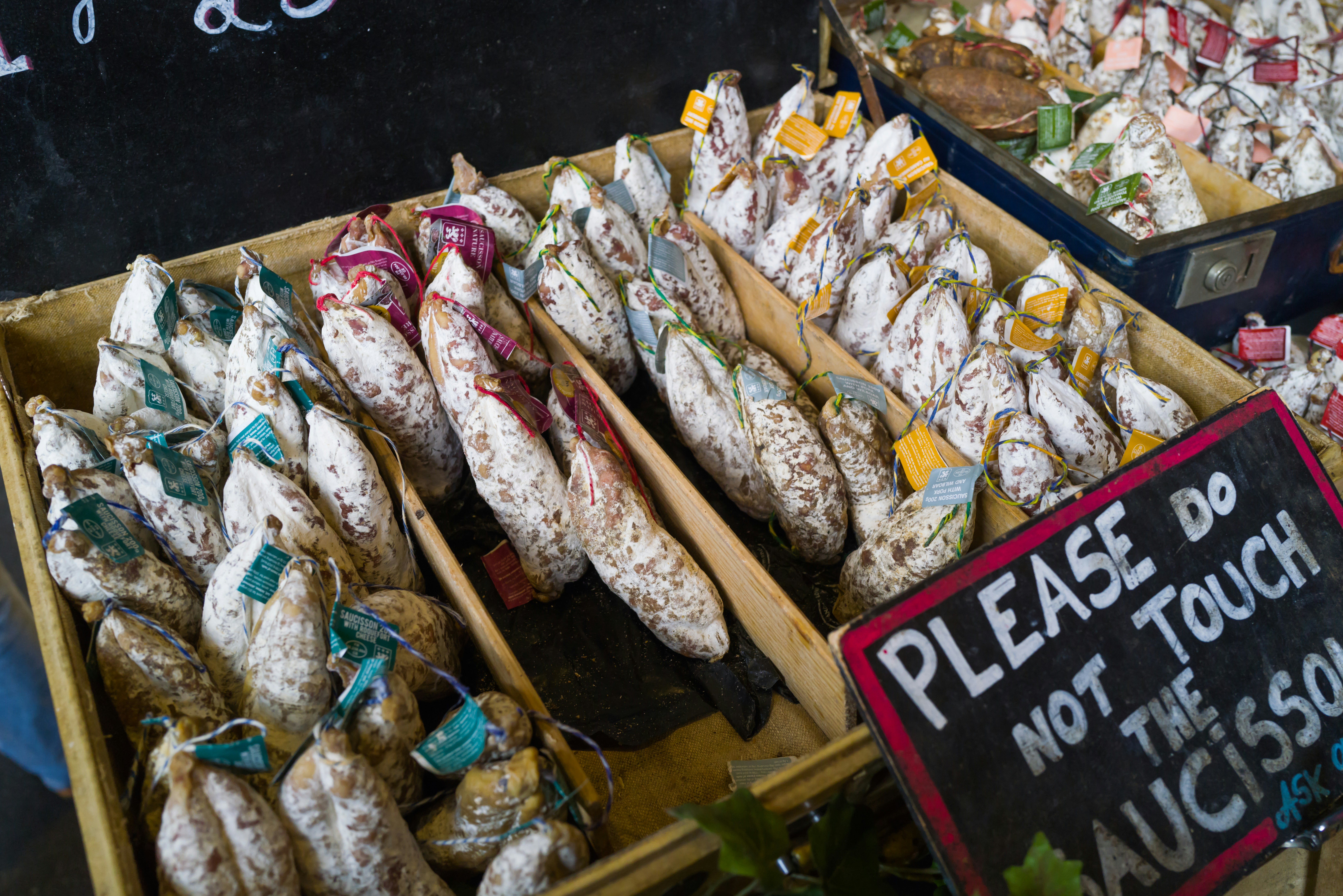 No-Touch Nook: Crates of Salted Fish at a Busy Market Stall