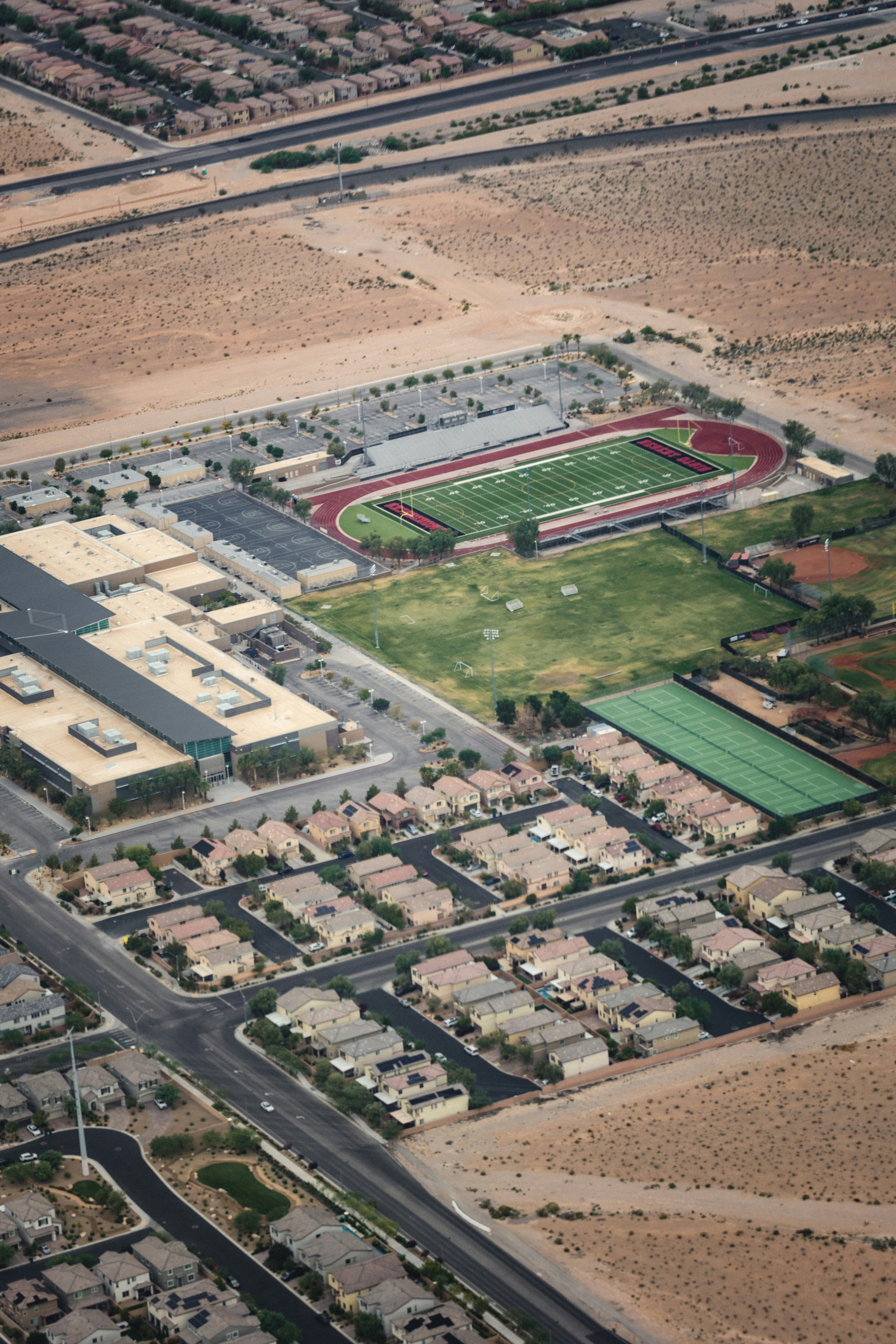 An aerial view of a football field in the middle of a desert photo ...