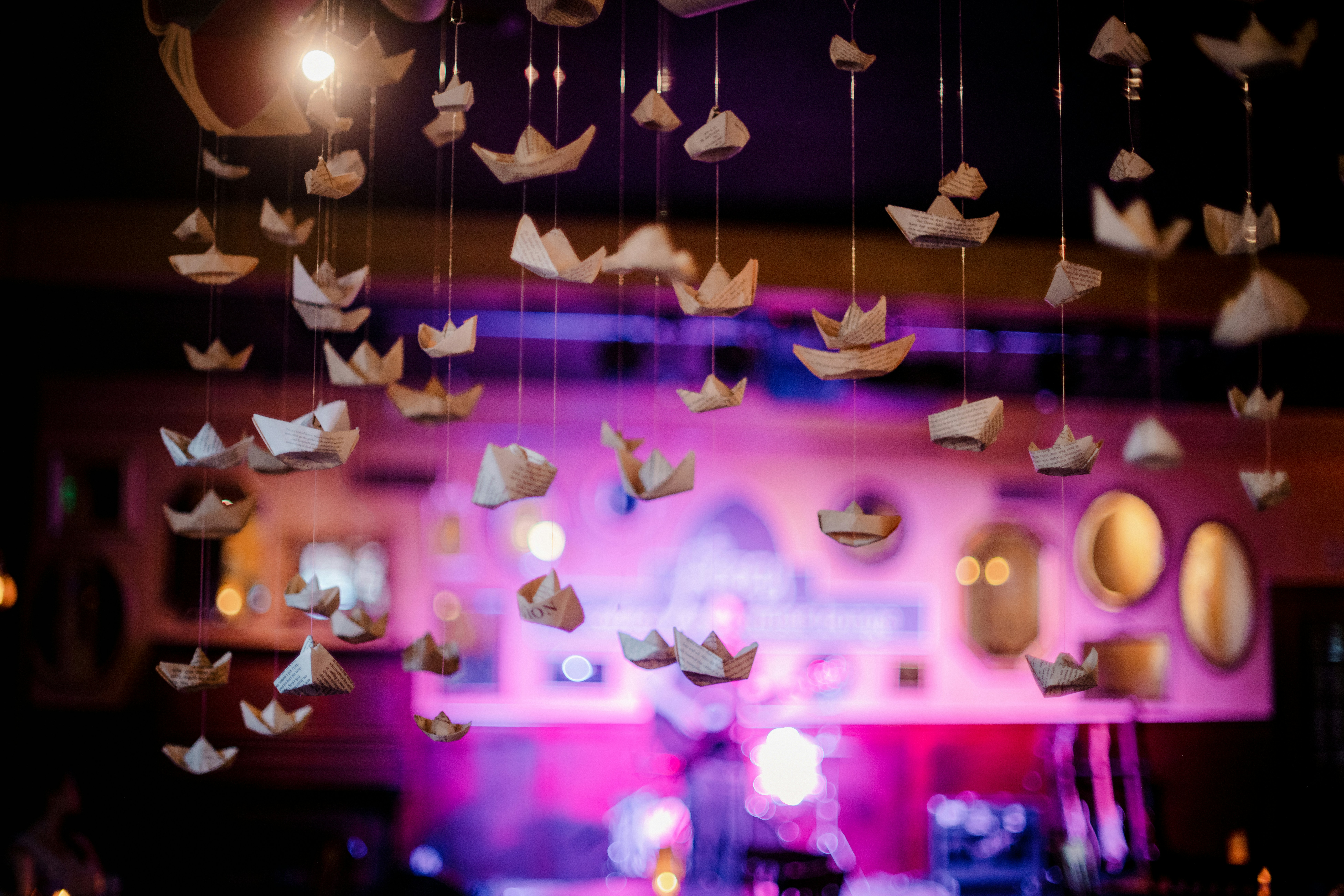 A group of paper birds hanging from strings photo – Free Woman Image on ...