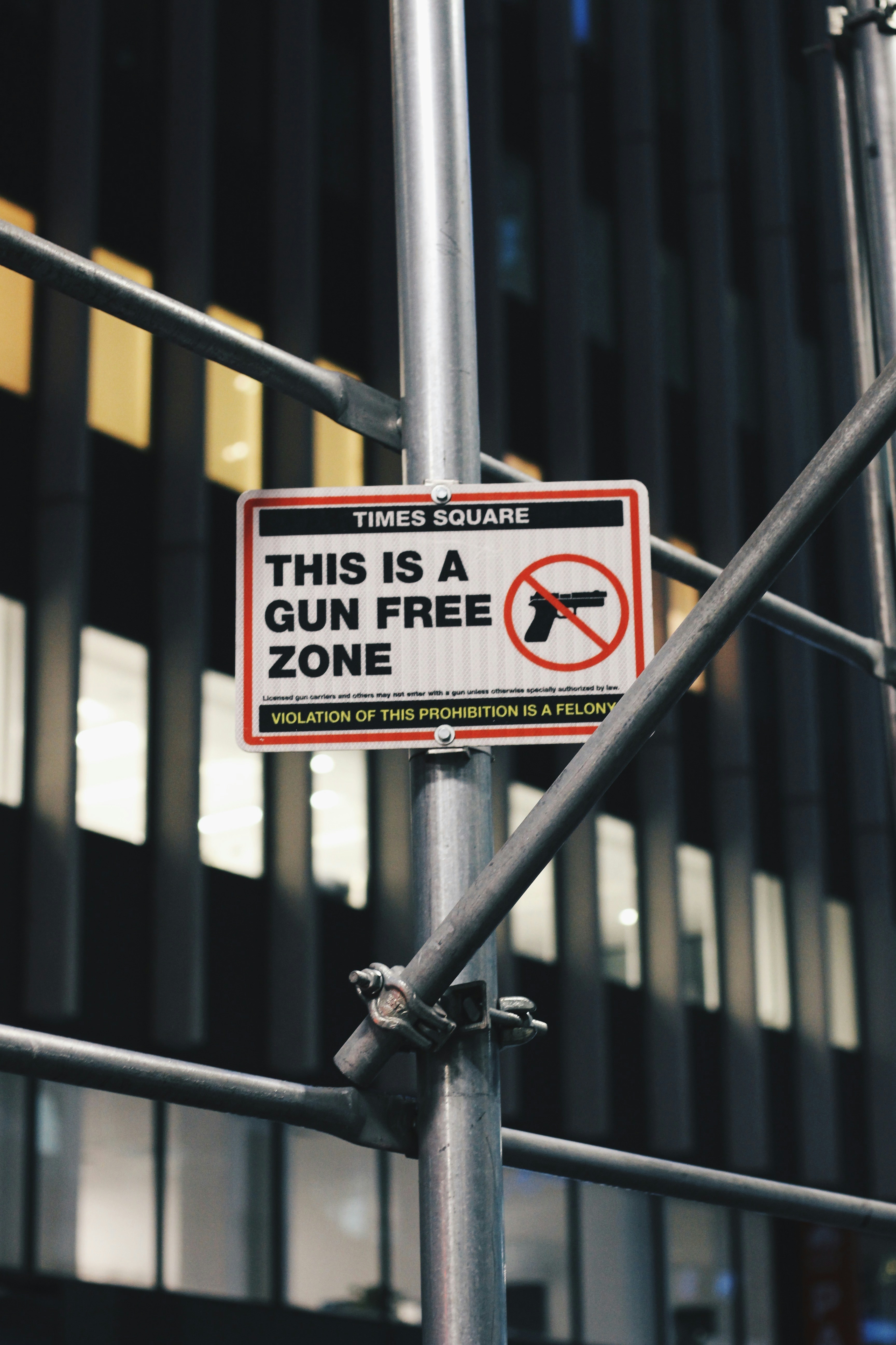 This is a gun free zone sign on a pole photo – Free Sign Image on Unsplash