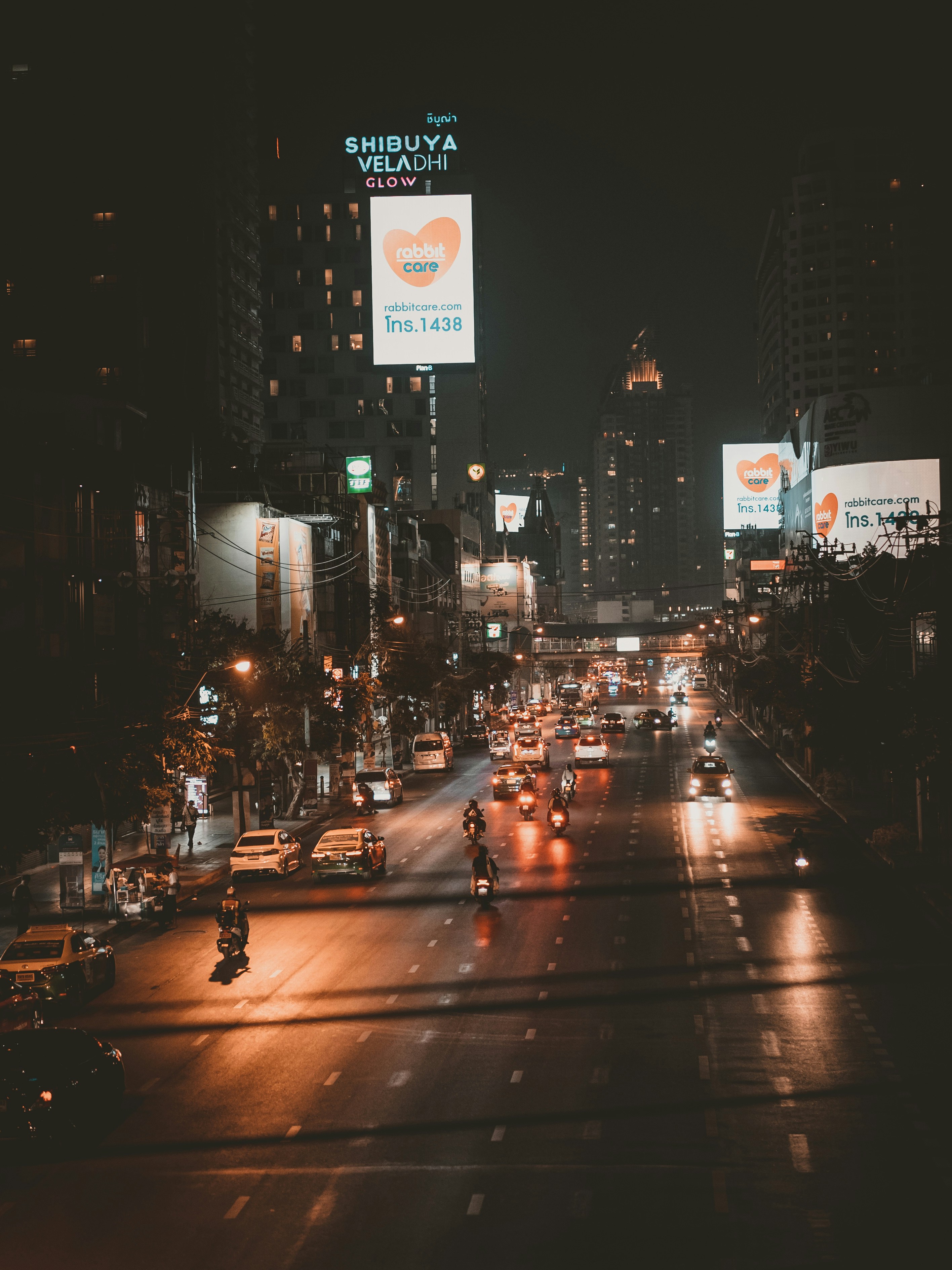 Midnight Boulevard: Neon Reflections on a Rain-Wet City Street