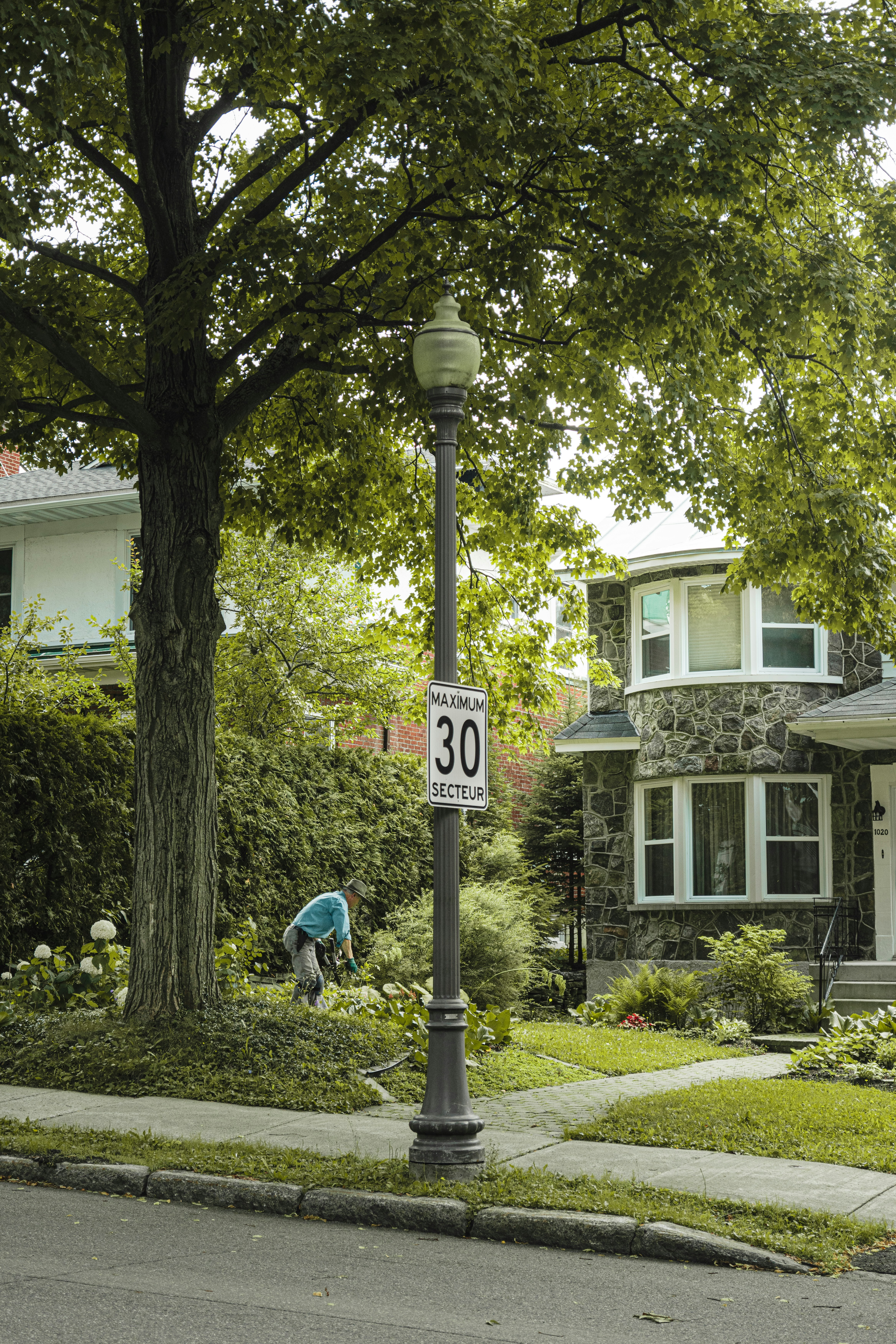 A street sign on a pole in front of a house photo – Free Vieux-québec ...