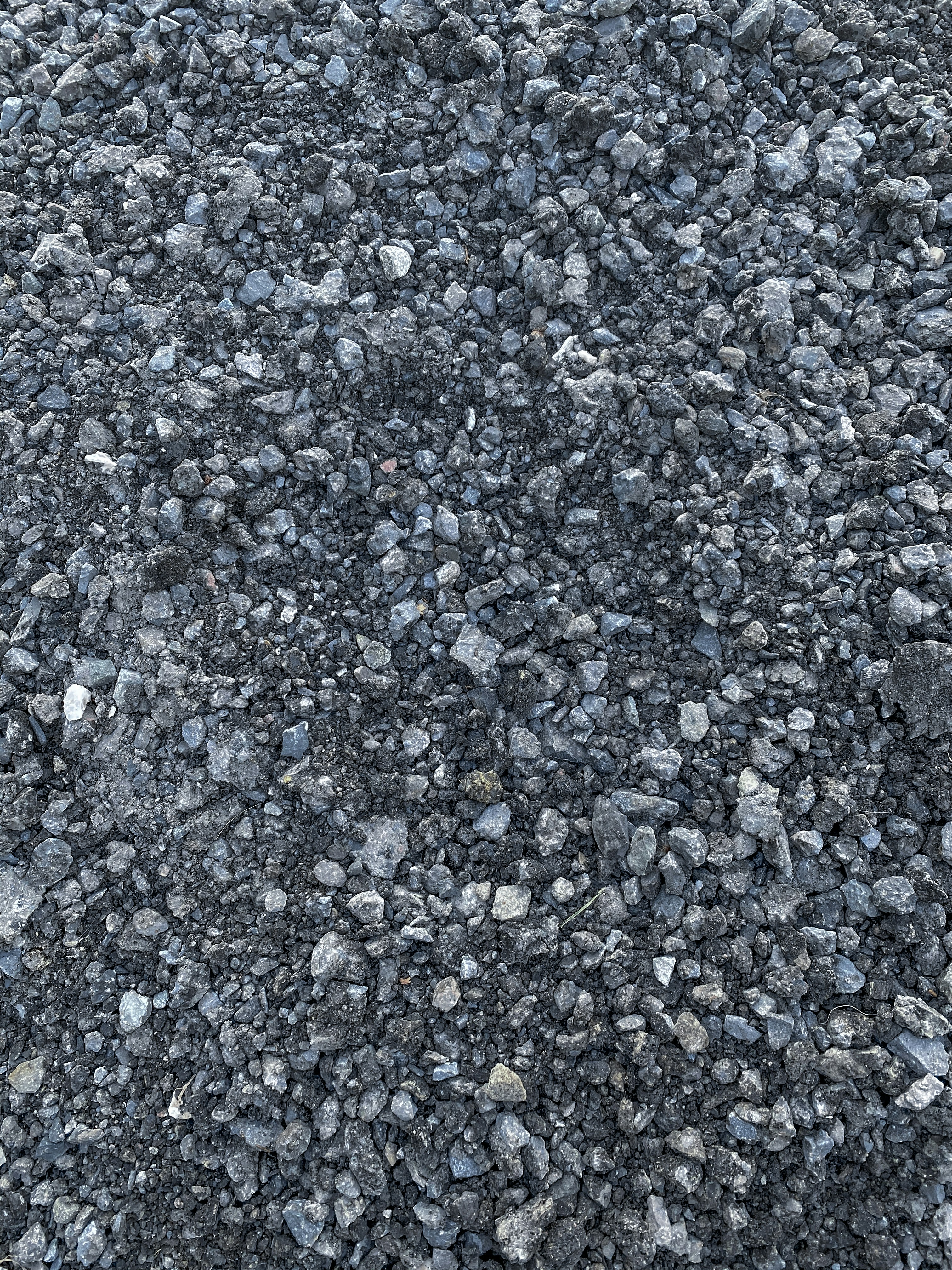 A close up of a street with rocks and gravel photo – Free Crumbled ...