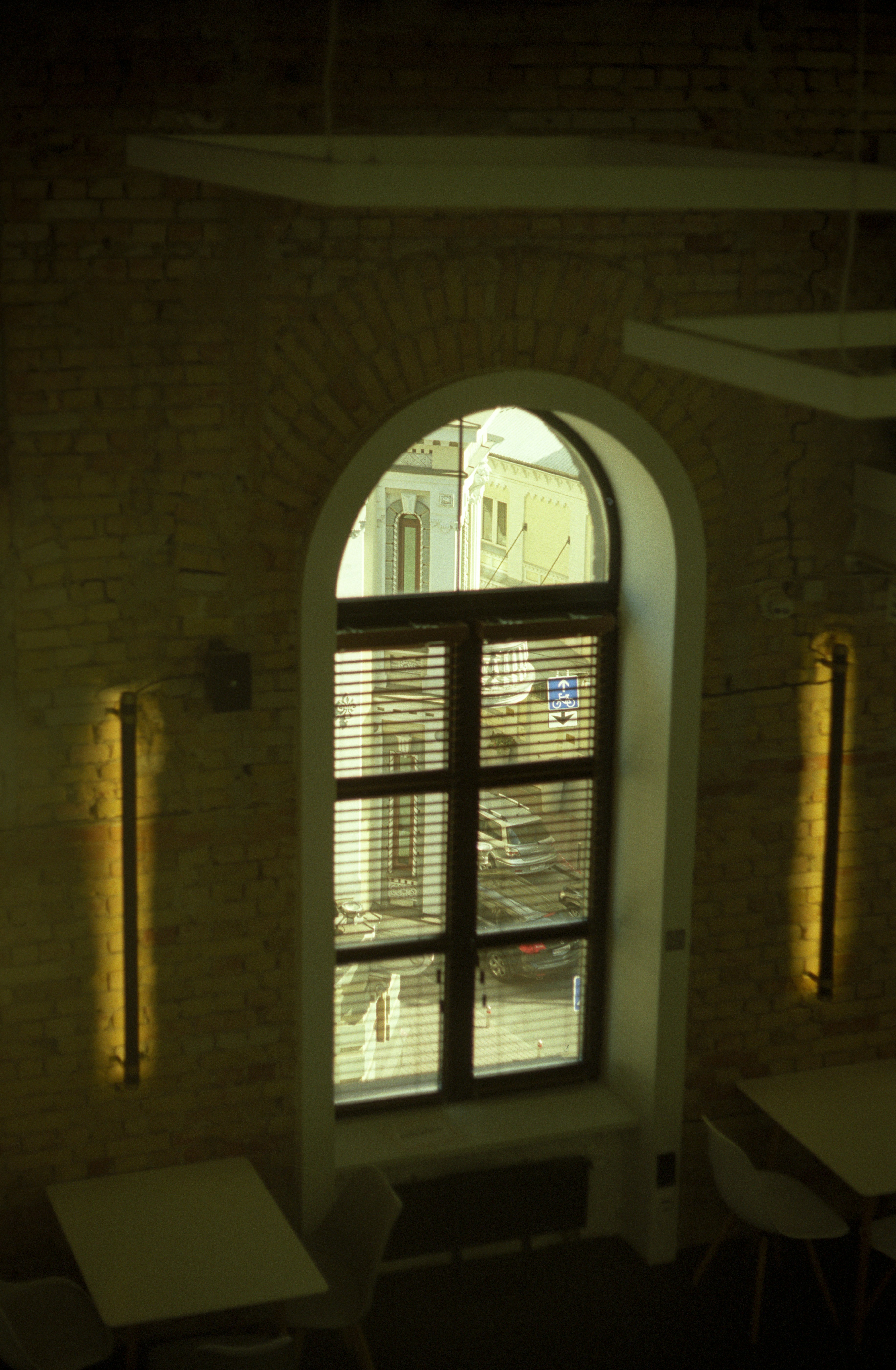 A window with a view of a street through it photo – Free Image on Unsplash