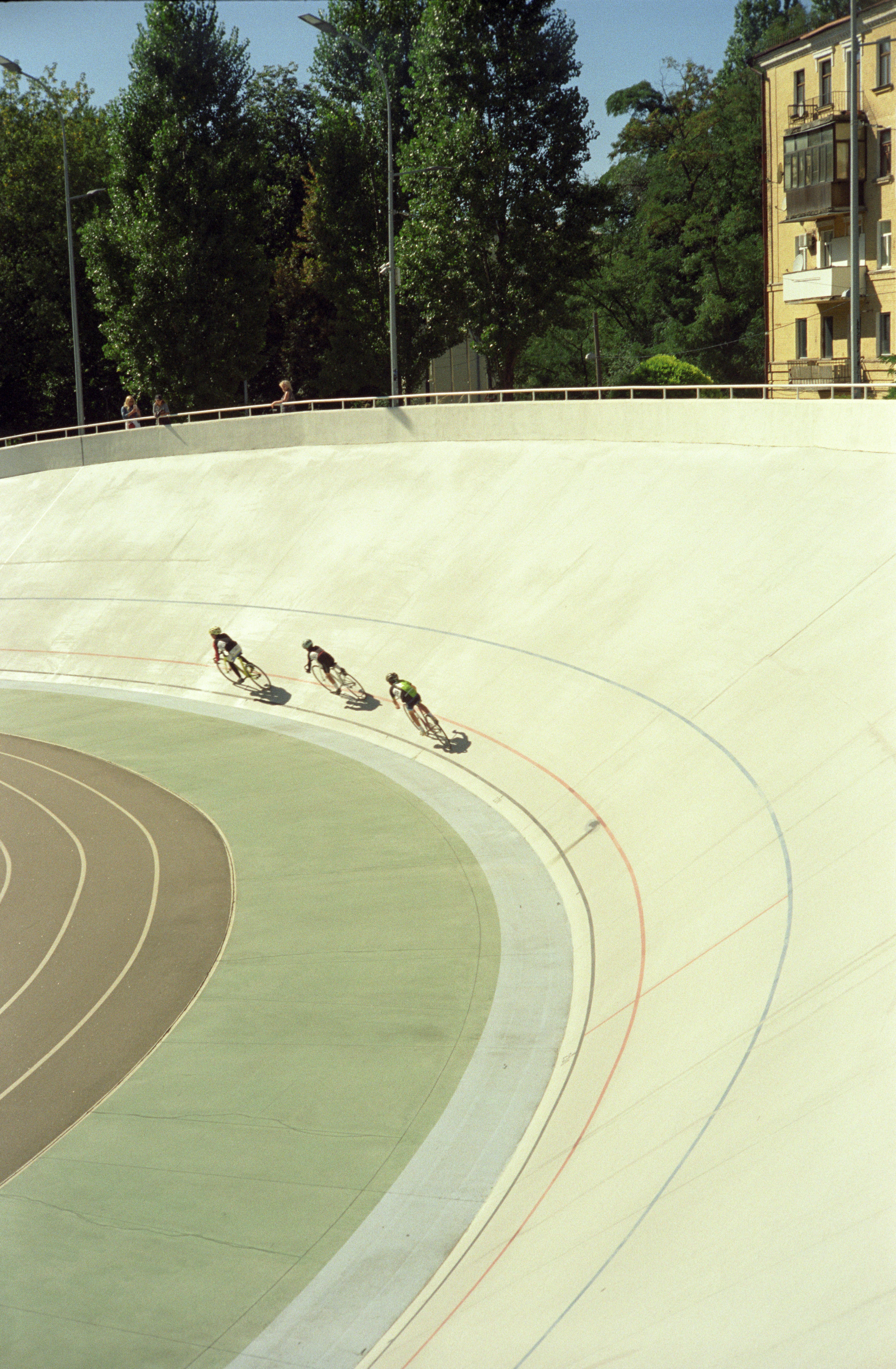 A group of people riding bikes on a track photo – Free Tree Image on ...