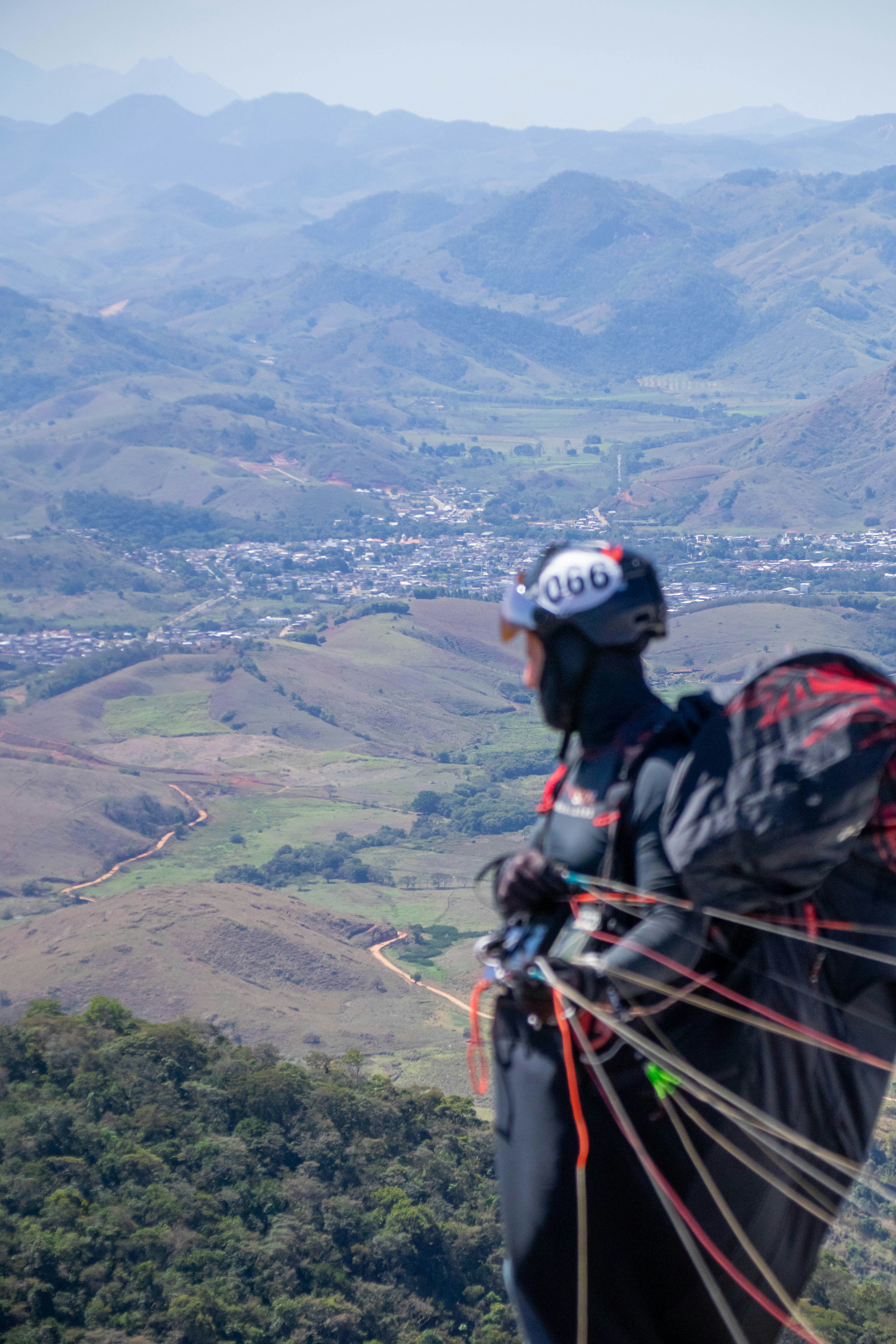 A man on top of a mountain with a parachute photo – Free Portrait Image ...