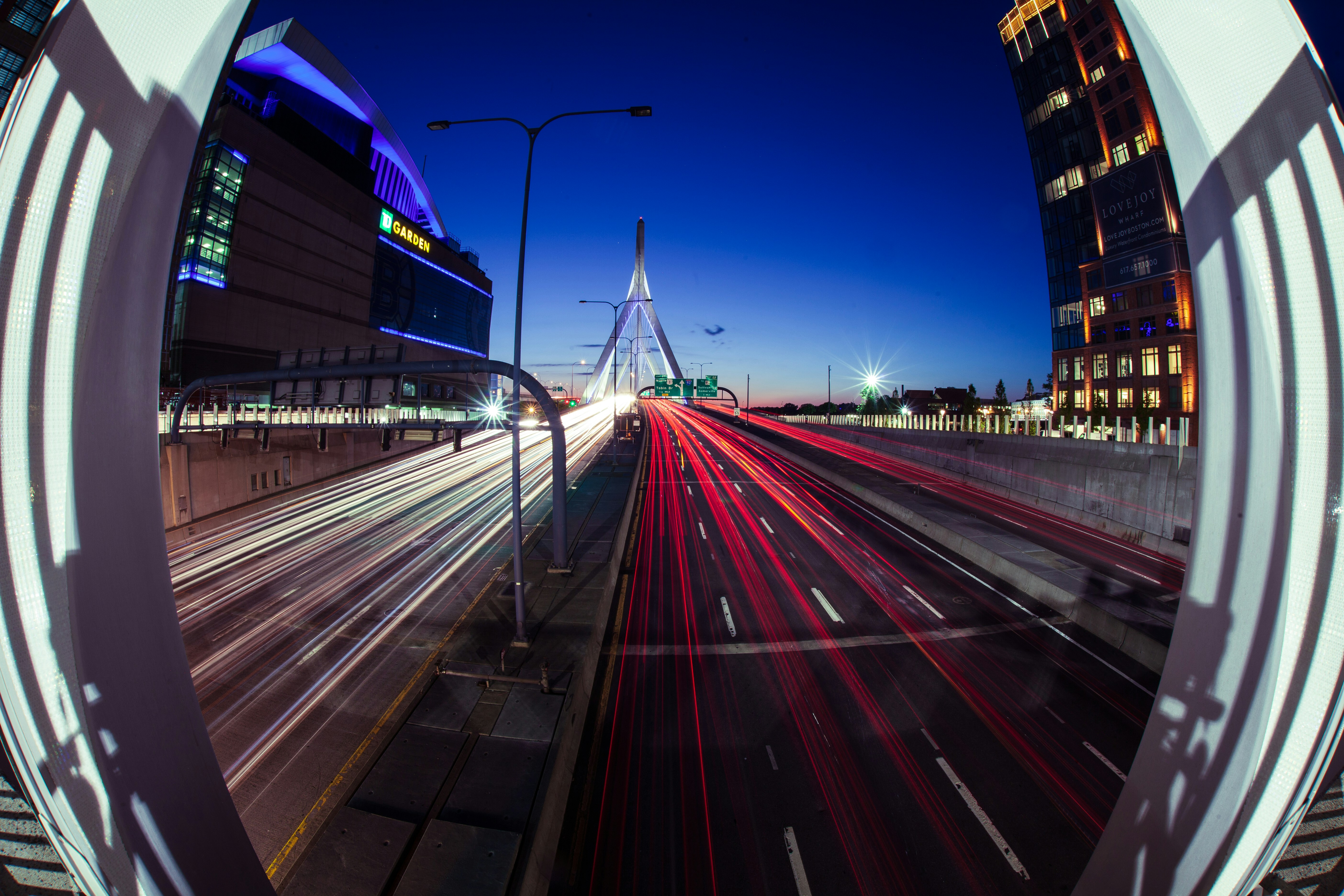 Neon Archways Over Red Rails: A Fish-Eye Night Bridge Shot