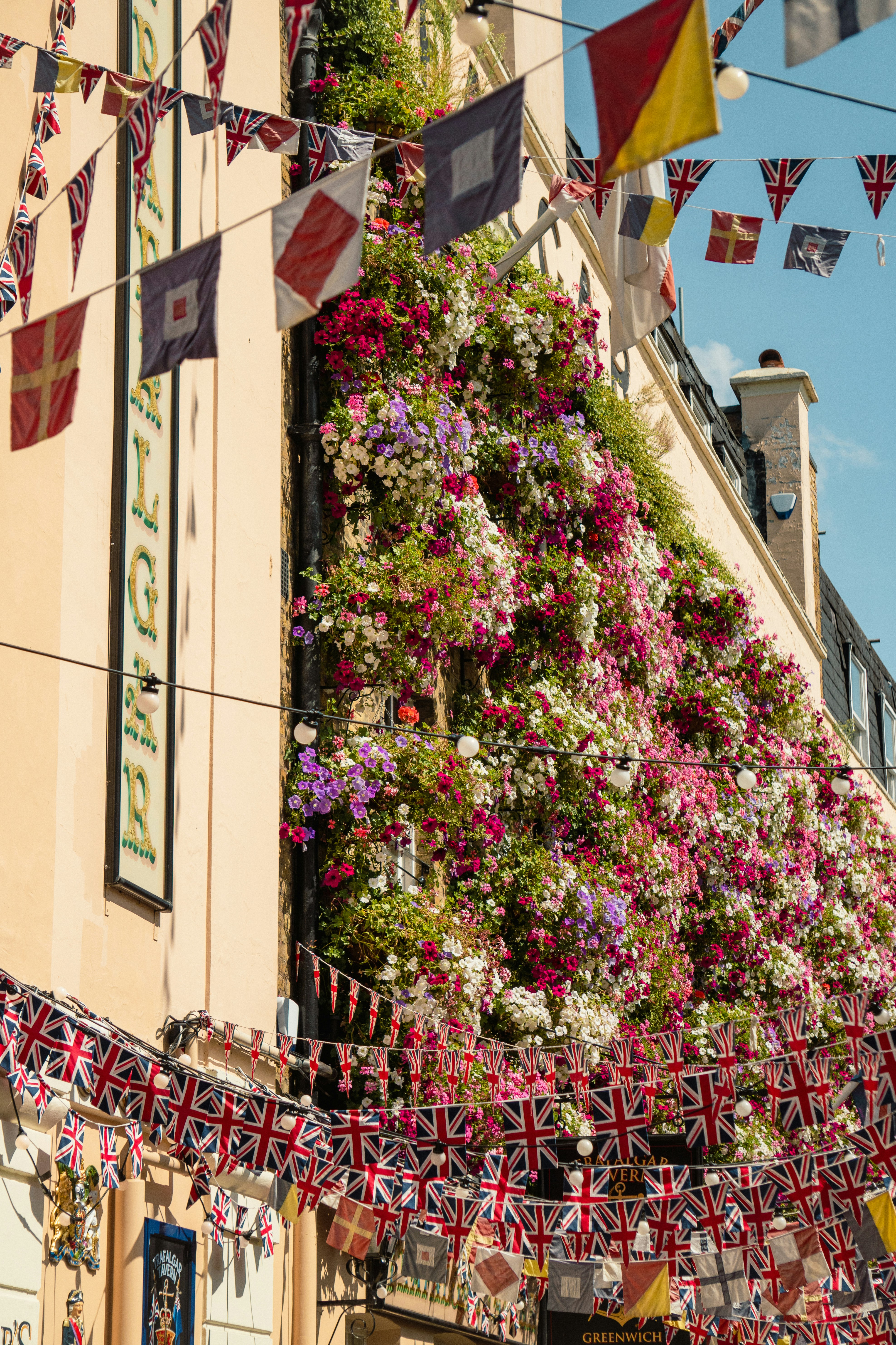 Floral Façade Beneath a Canopy of Union Flags