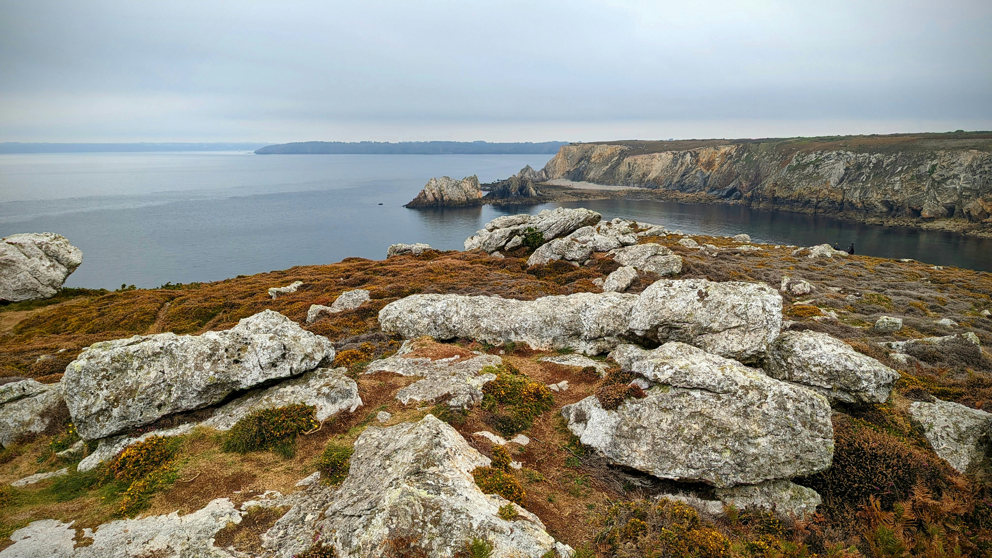 Coastal Serenity Amid Rugged Cliffs