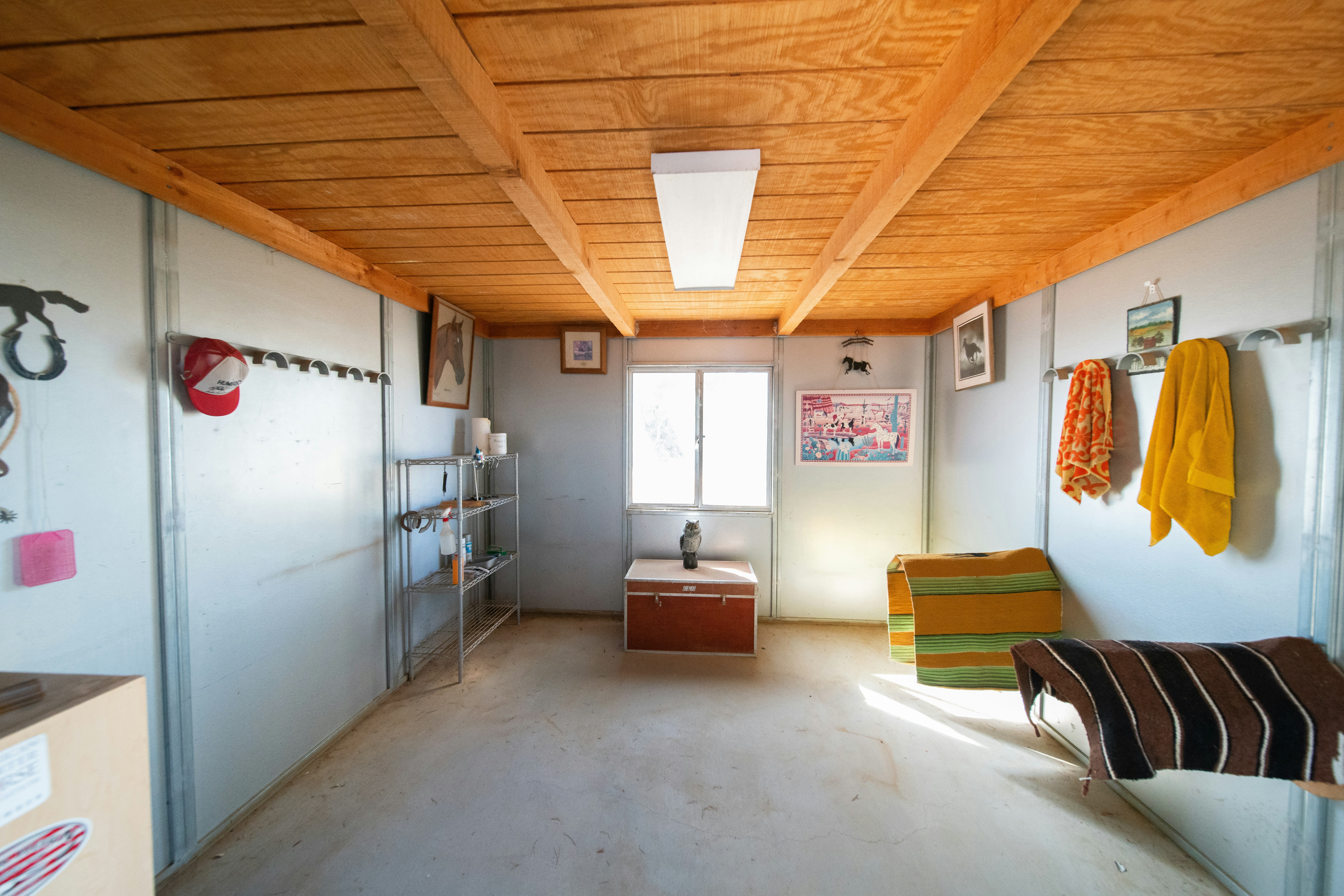 A room with a lot of clutter on the walls photo – Free Barn decorations ...