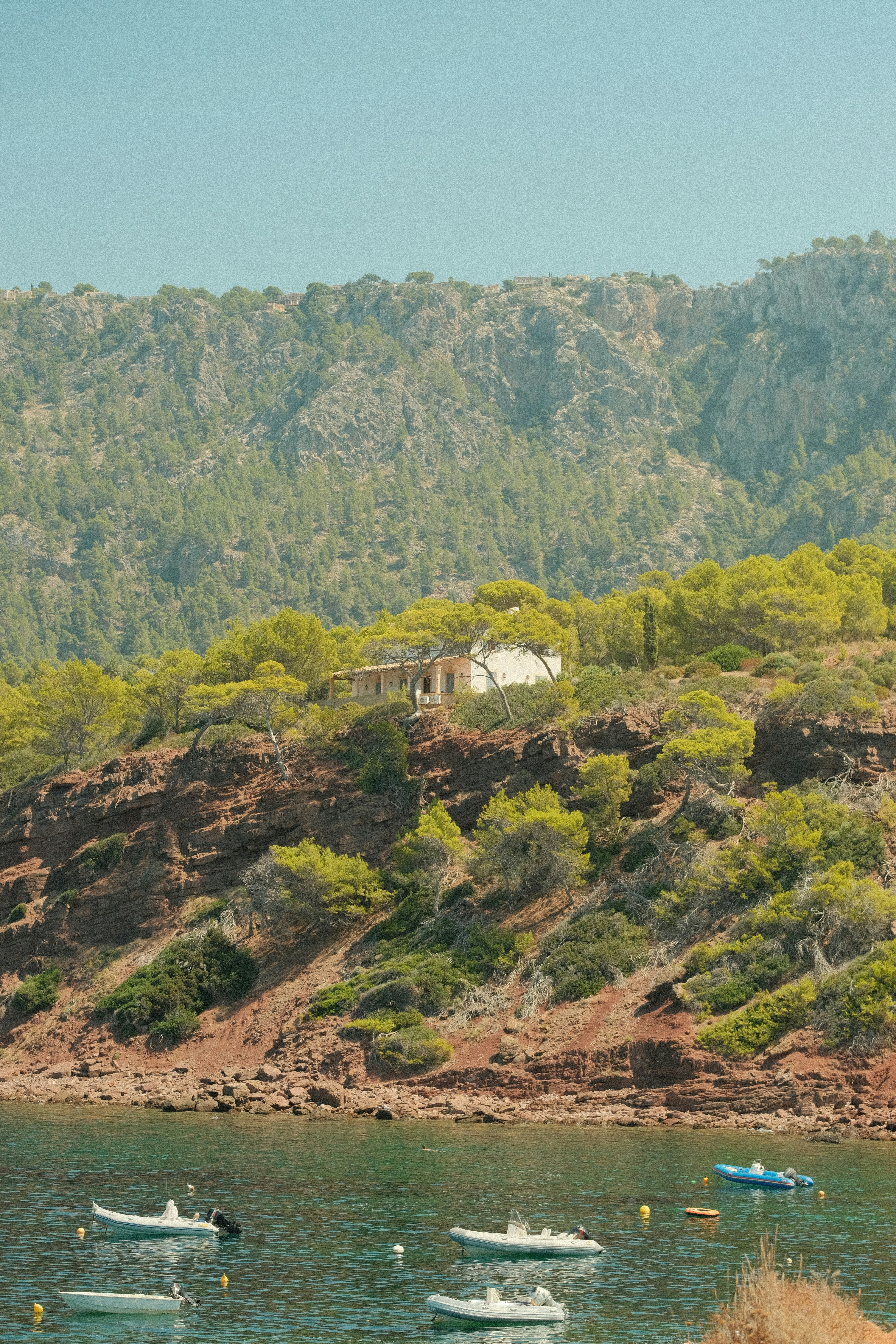 Secluded coastal villa perched above sunlit pines