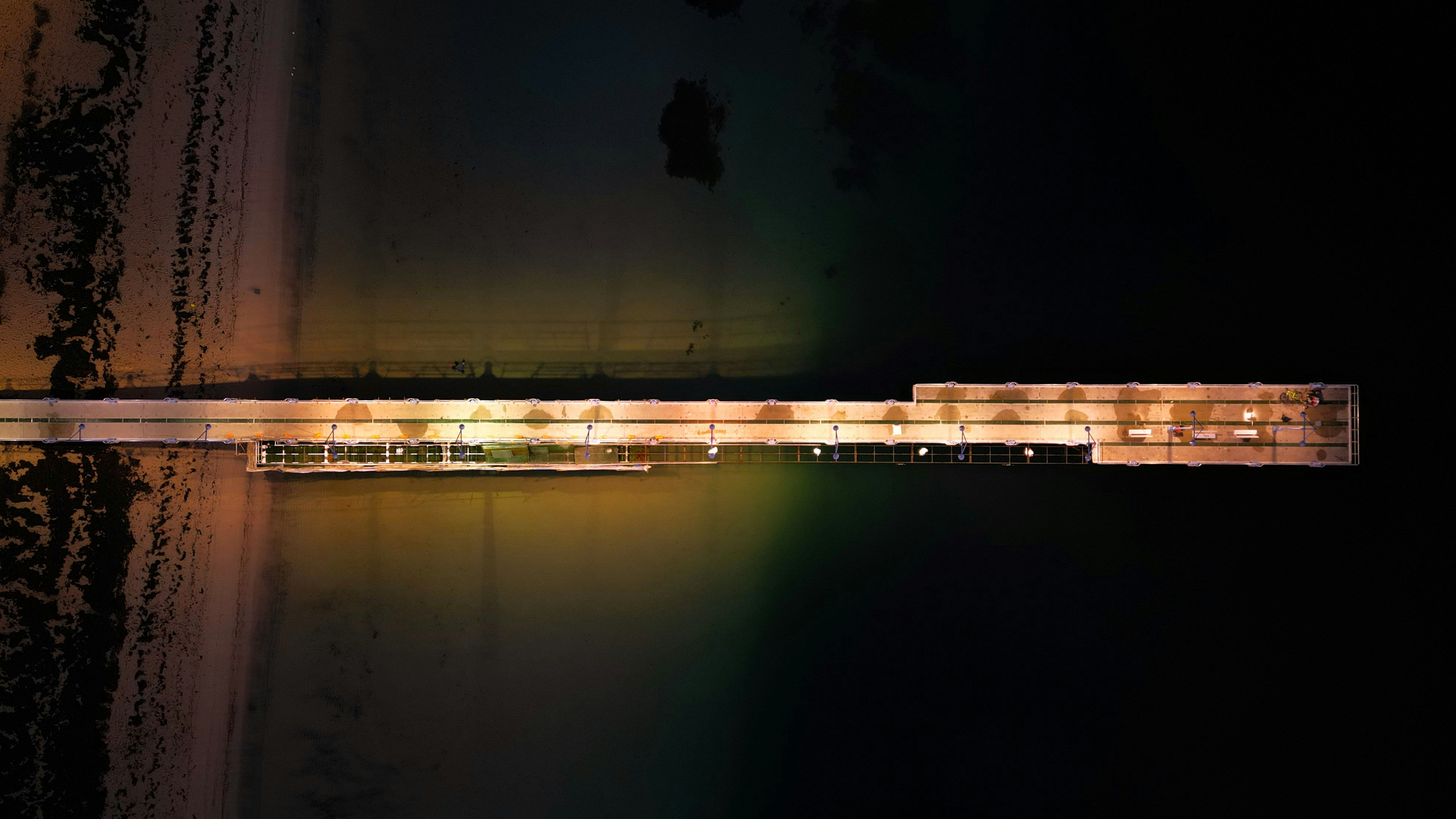 Midnight Pier: A Quiet Cadence of Light Across Dark Waters