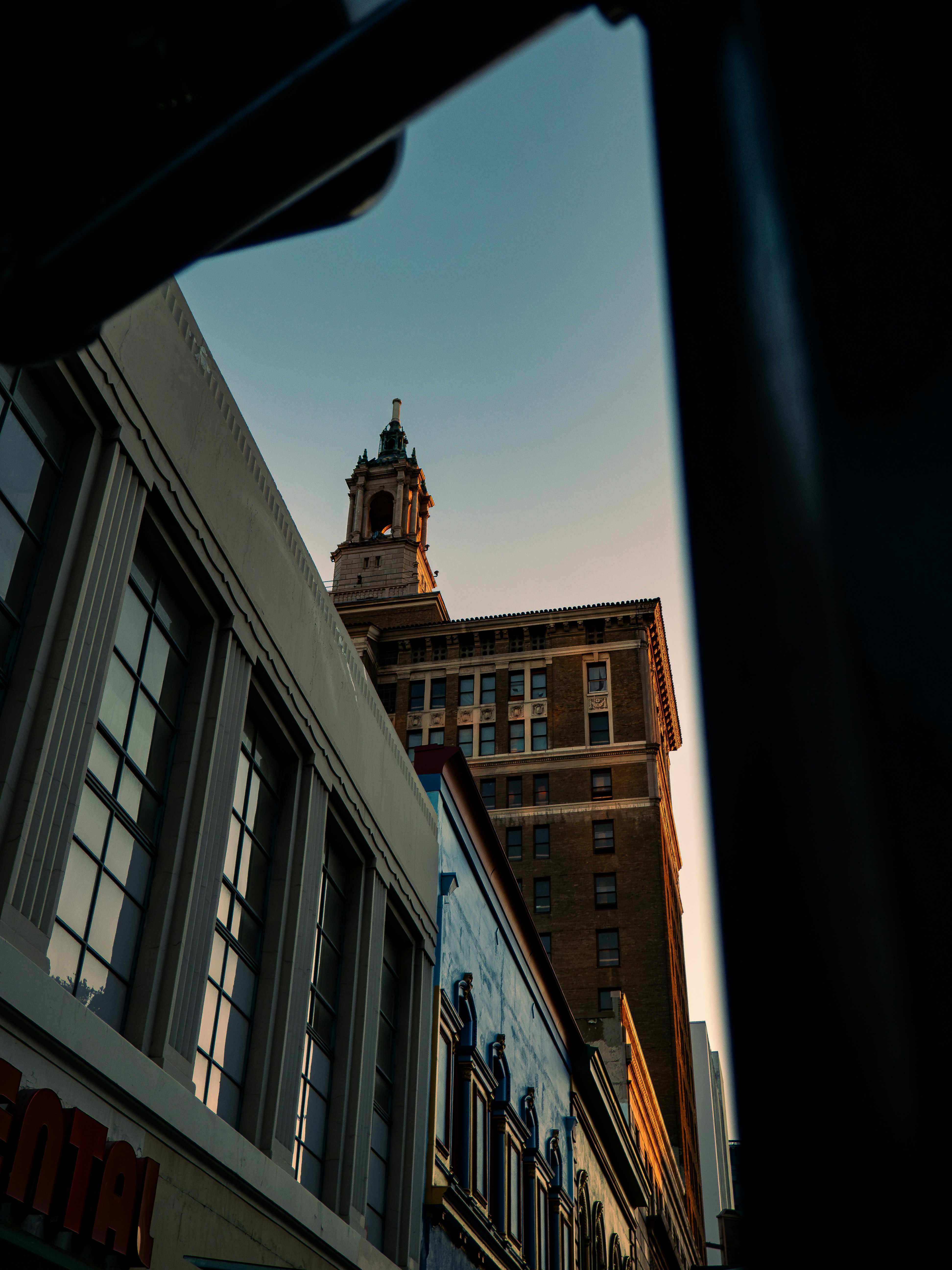 Clock Tower in a Narrow Canyon: Golden Light on a City Spine