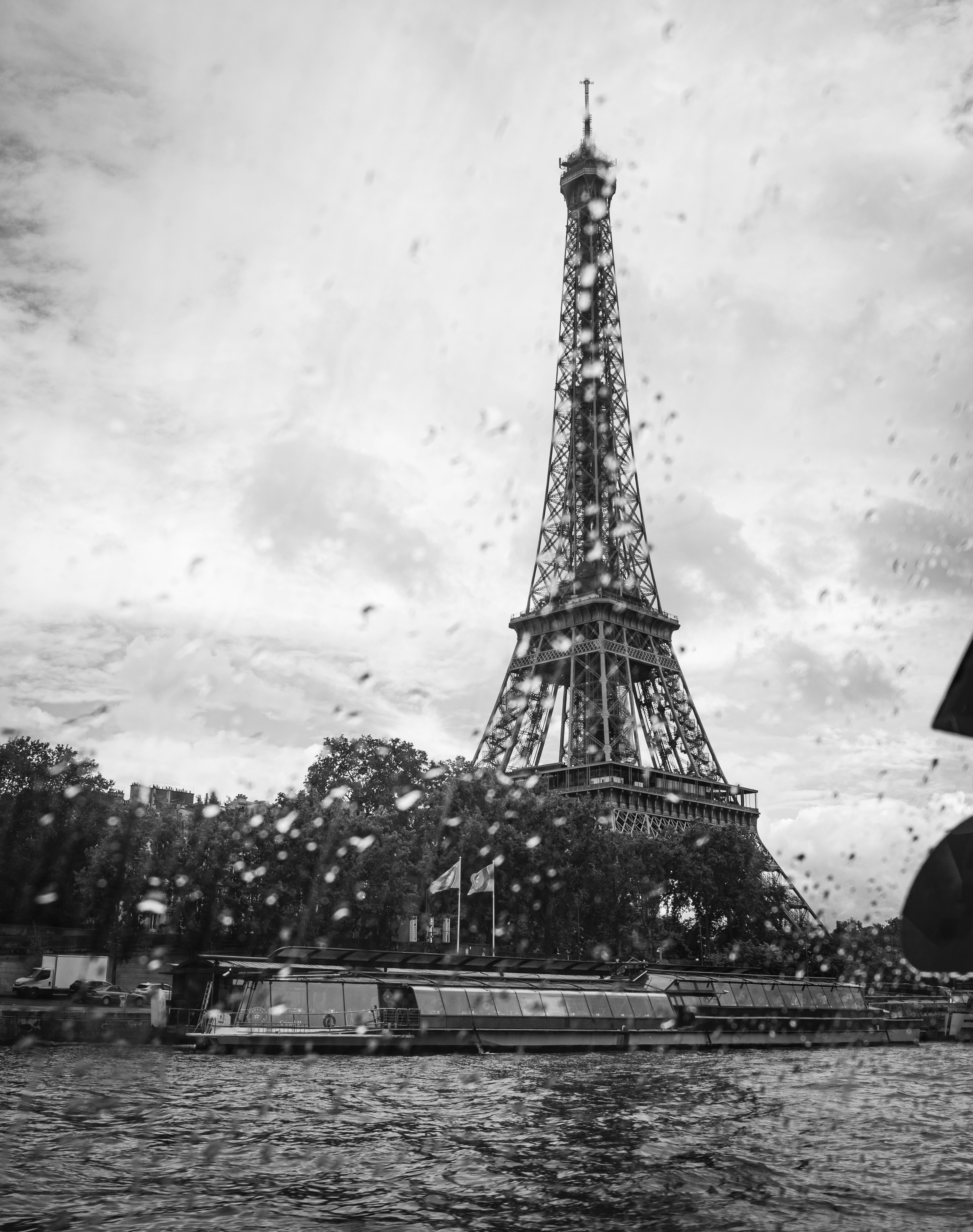 Rain-Splashed Window View: Eiffel Tower over the Seine