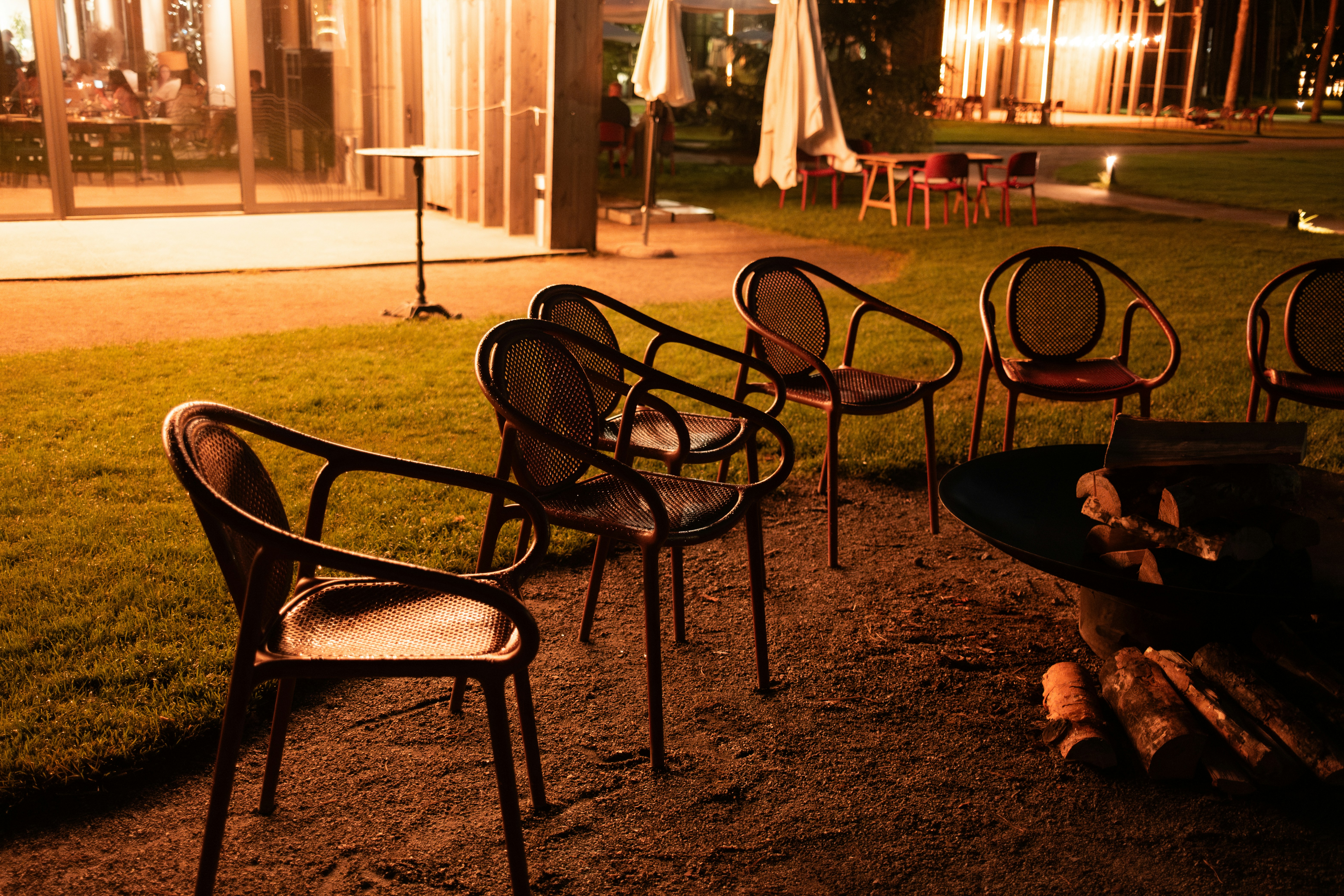 Ember Circle by the Fire Pit: A Quiet Patio of Wicker Chairs Under Night Lights