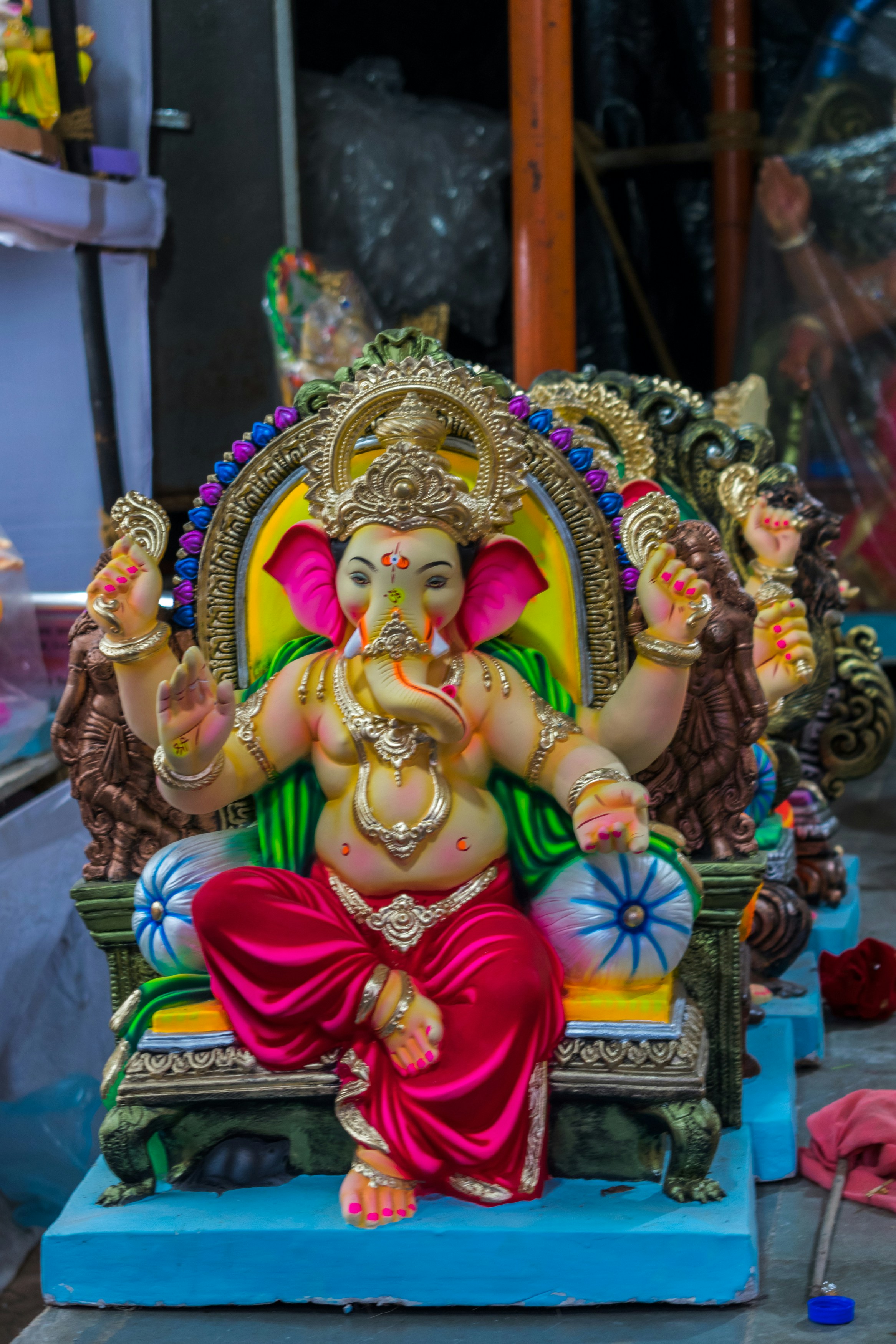 A statue of a ganesh sitting on a chair photo – Free Business Image on ...