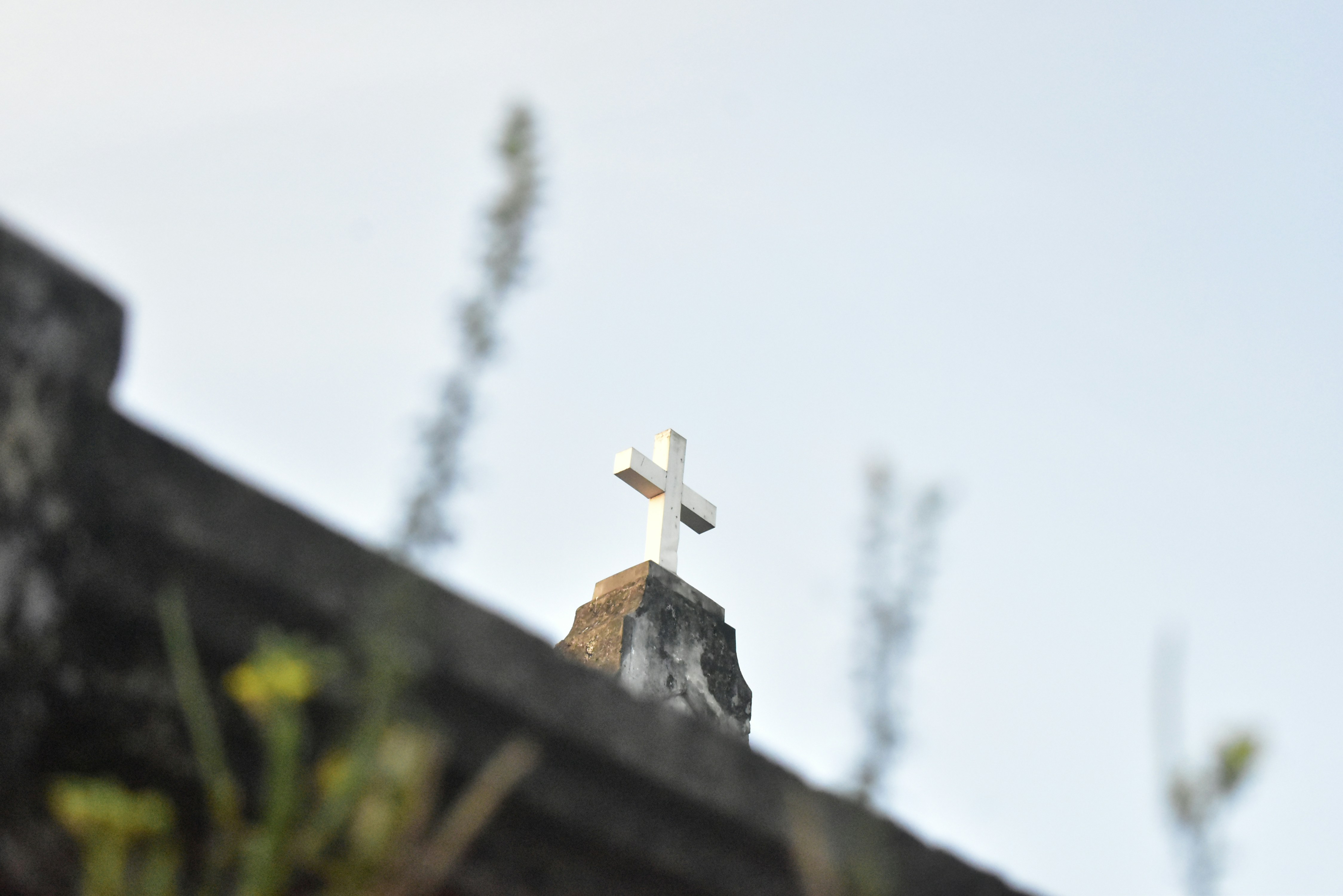 Cross on the Crest: A Quiet Moment Above the Wall