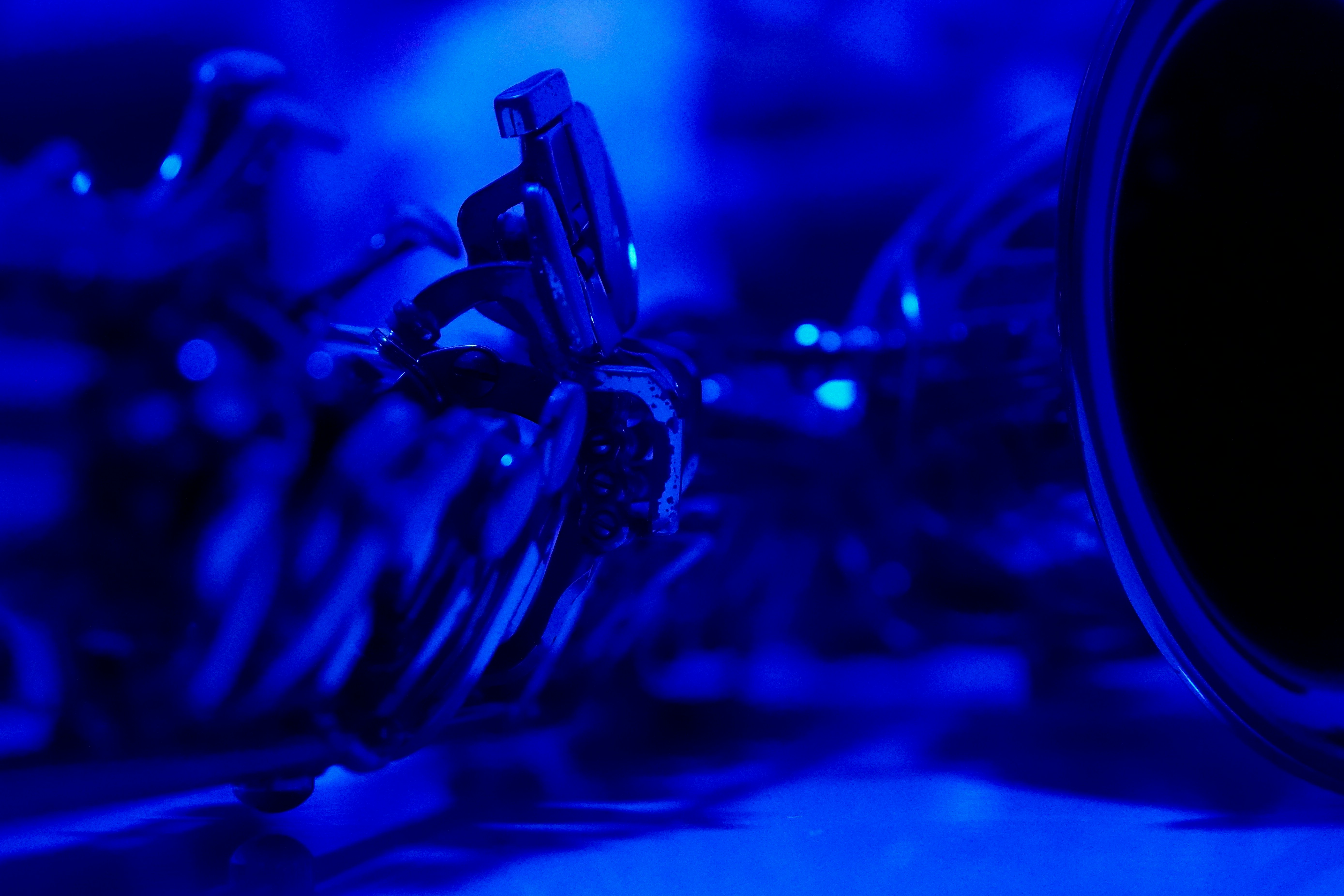 A close up of a metal object on a table photo – Free Saxophone Image on ...