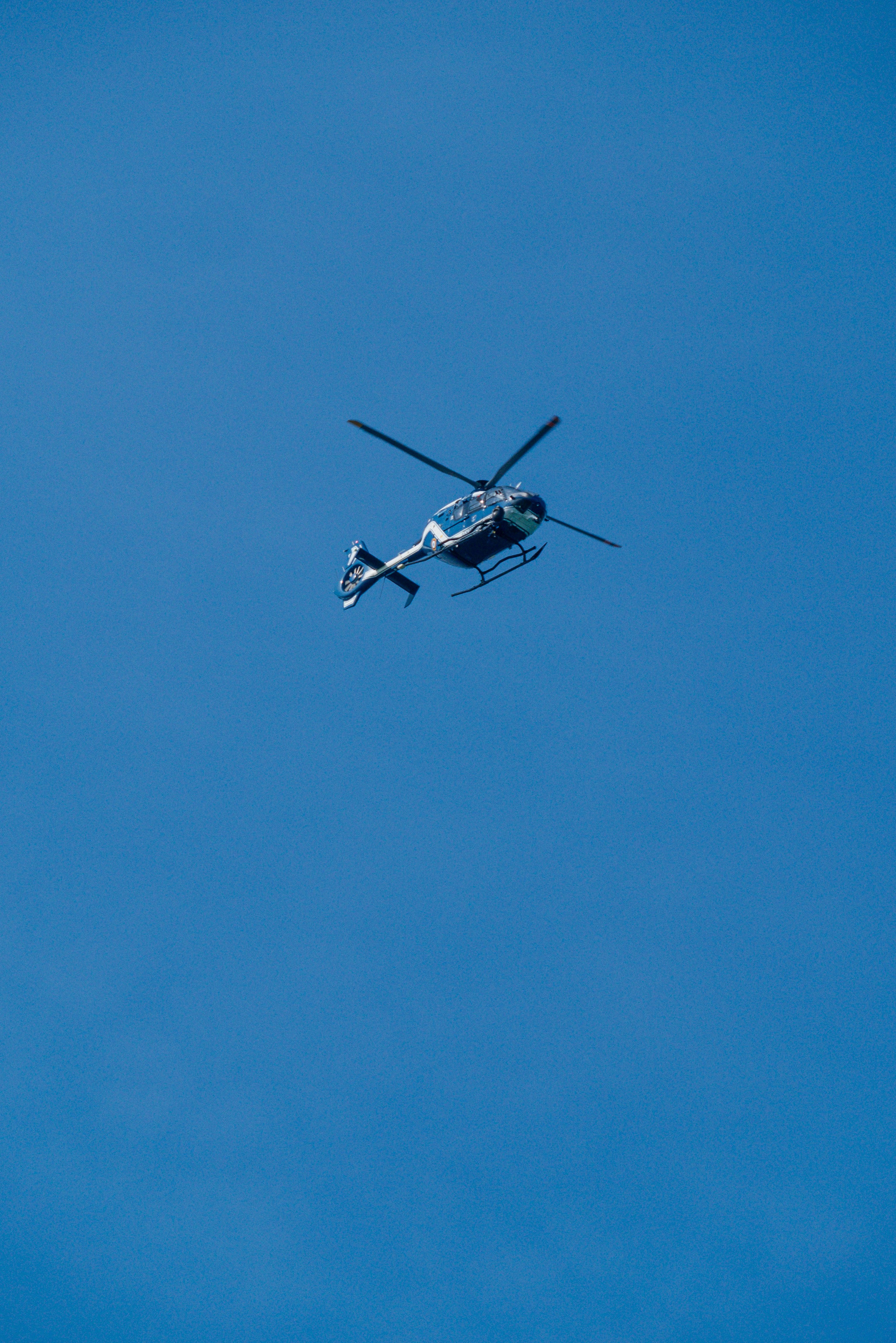Azure Transit: Helicopter in a Clear Sky Glide