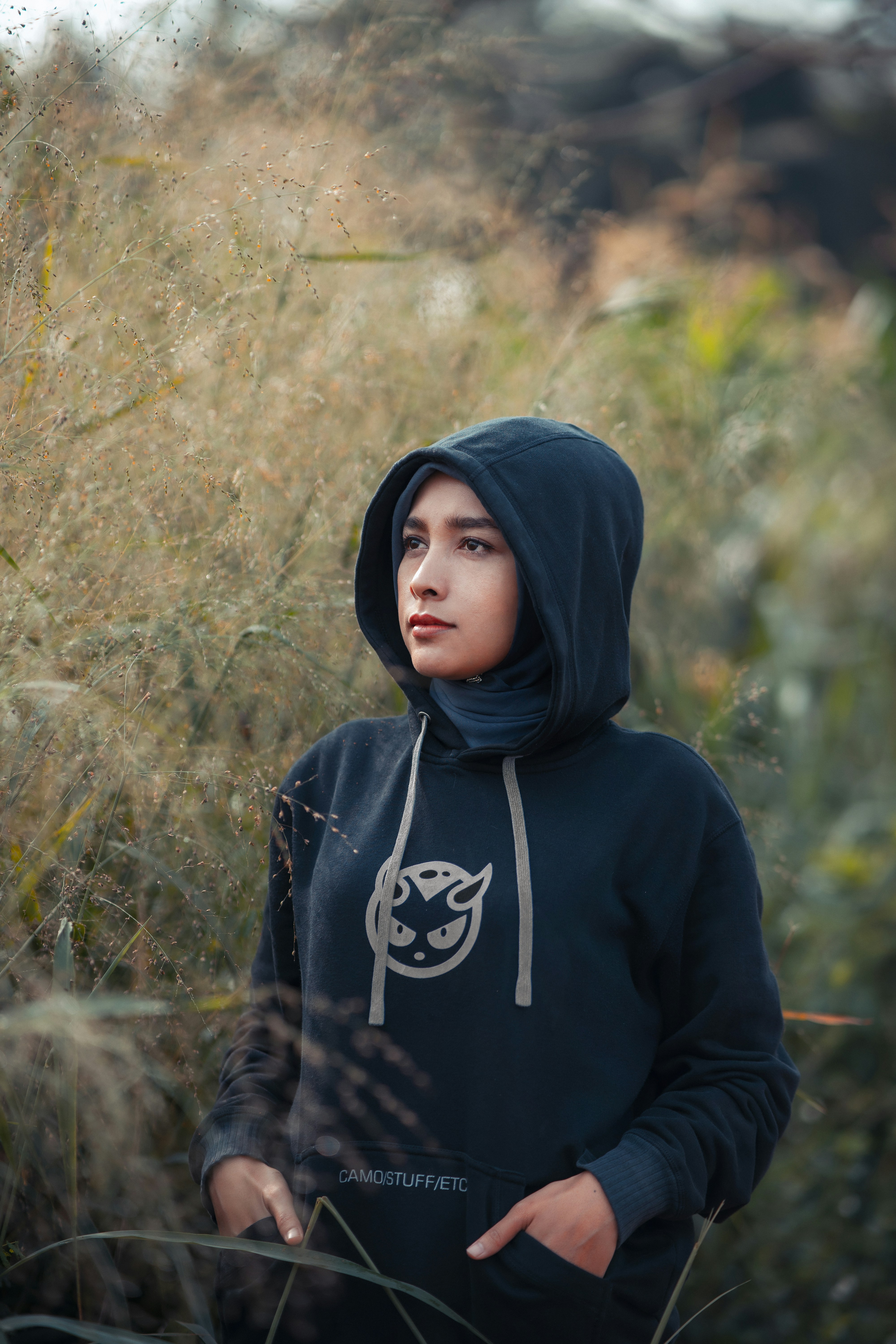 Quiet Portrait Amid Tall Grasses in Autumn Light