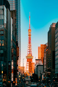 Tokyo Tower Rising Through a Sunset Alley of Skyscrapers