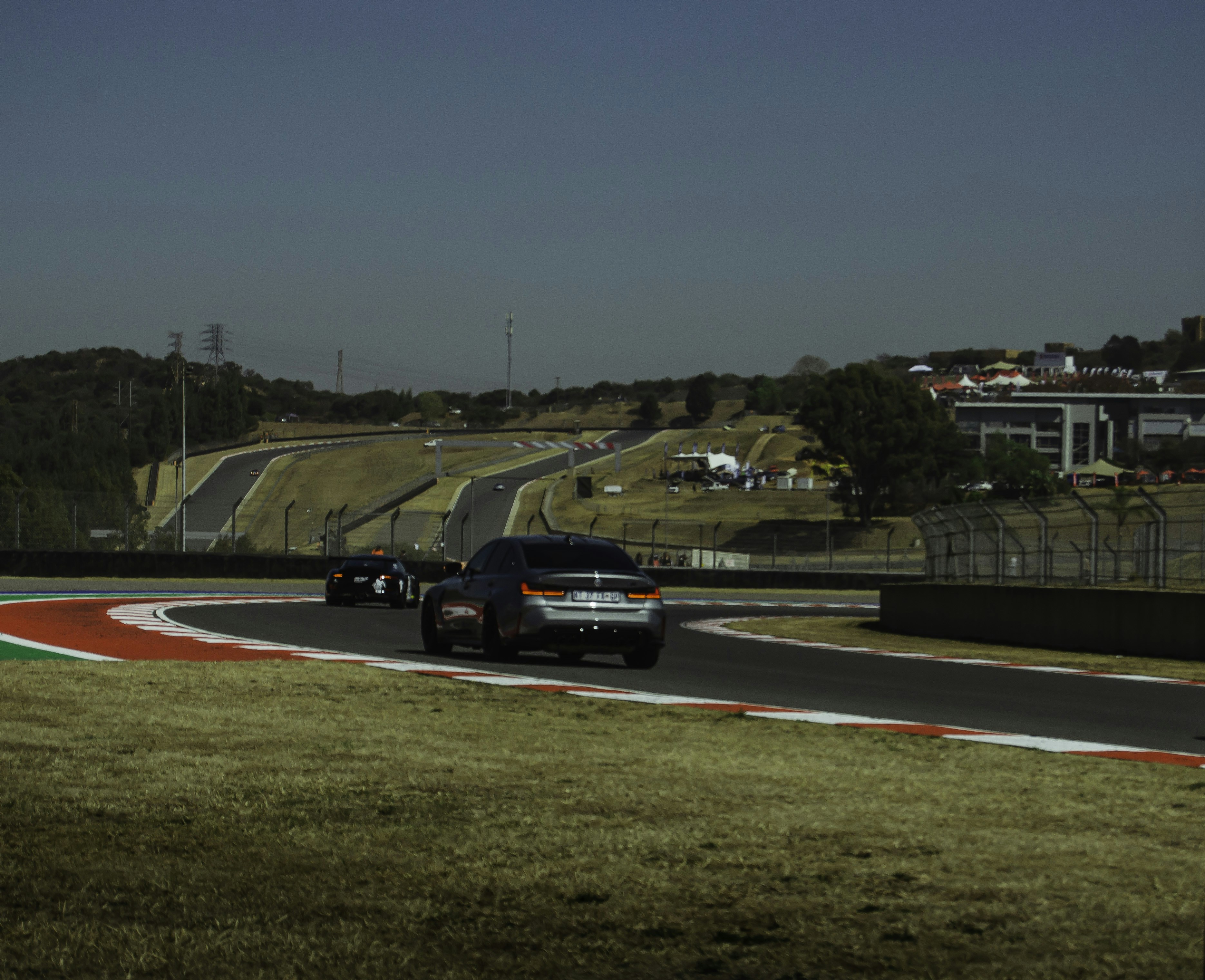 A police car driving down a race track photo – Free Kyalami estate ...