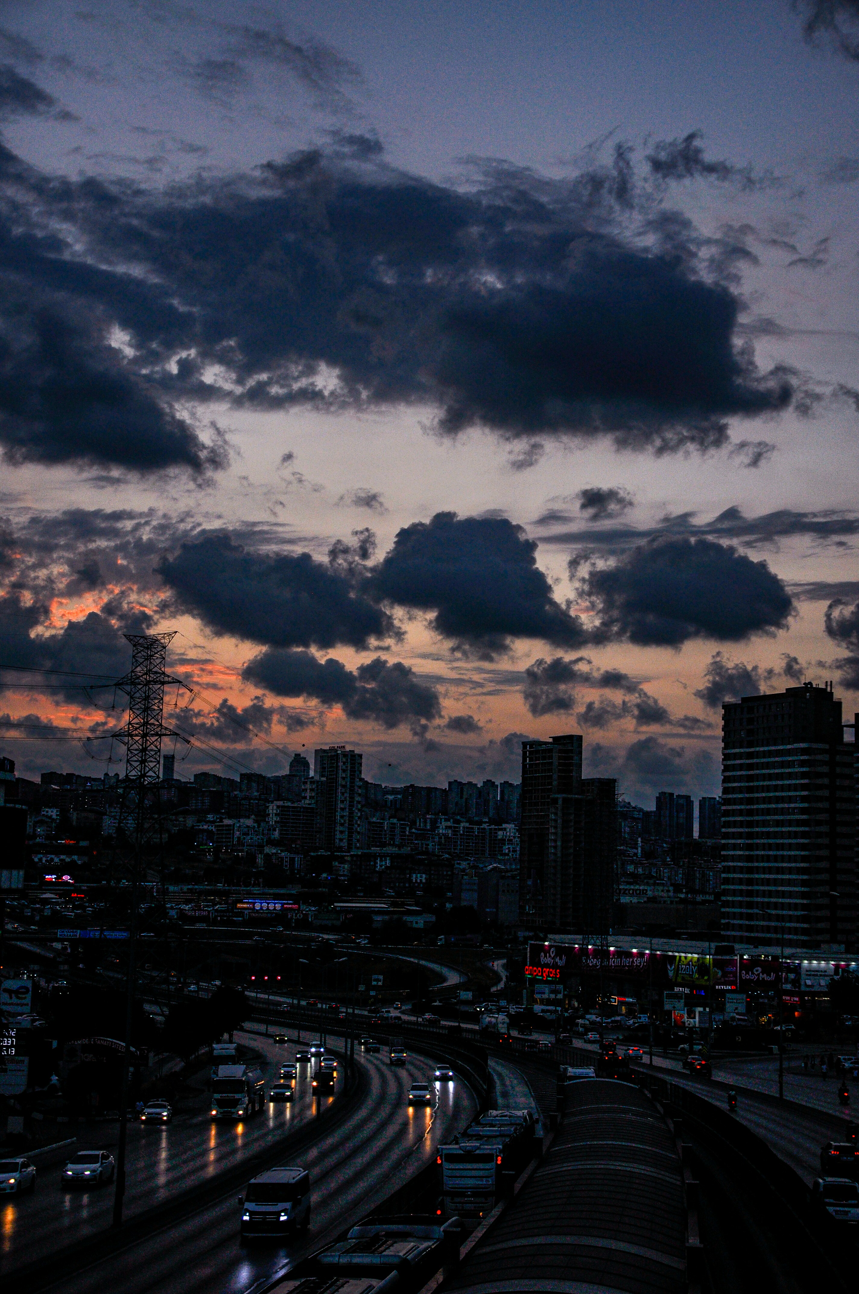 Evening Traffic Ballet Over a Dusk-lit Skyline