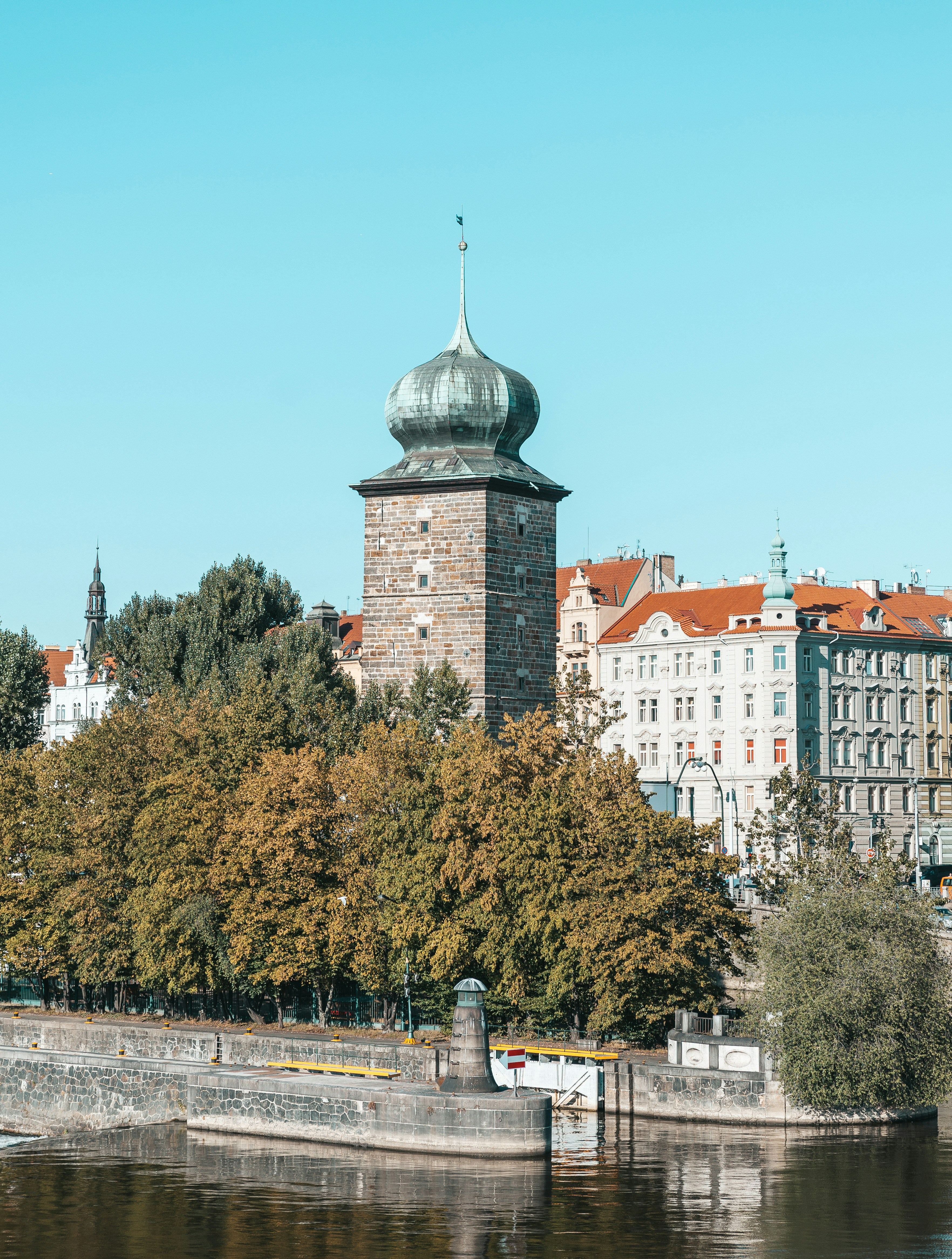 Verdigris Onion Dome Over a Riverside Row of Historic Facades