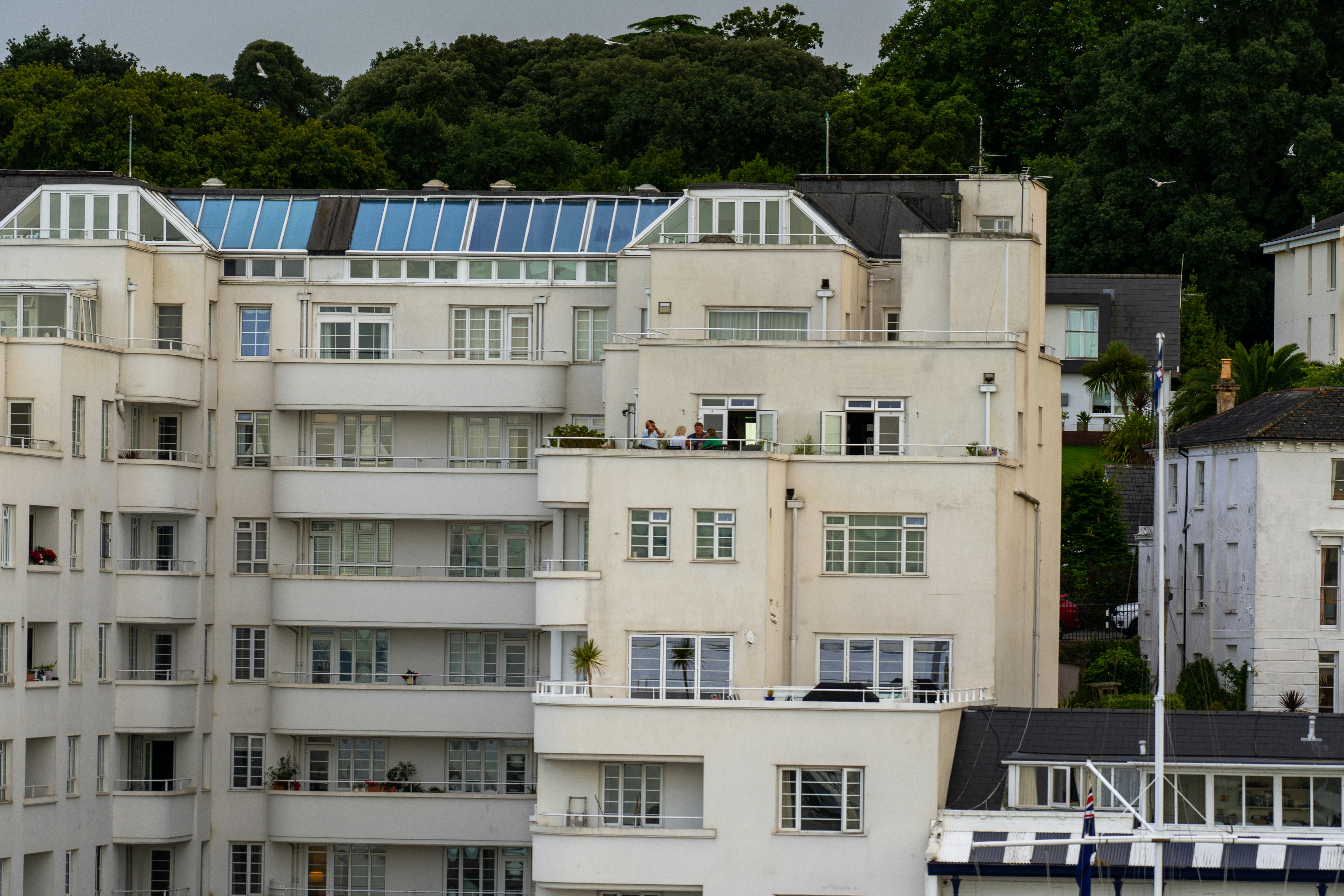 A group of buildings with a boat in front of them photo – Free Isle of ...