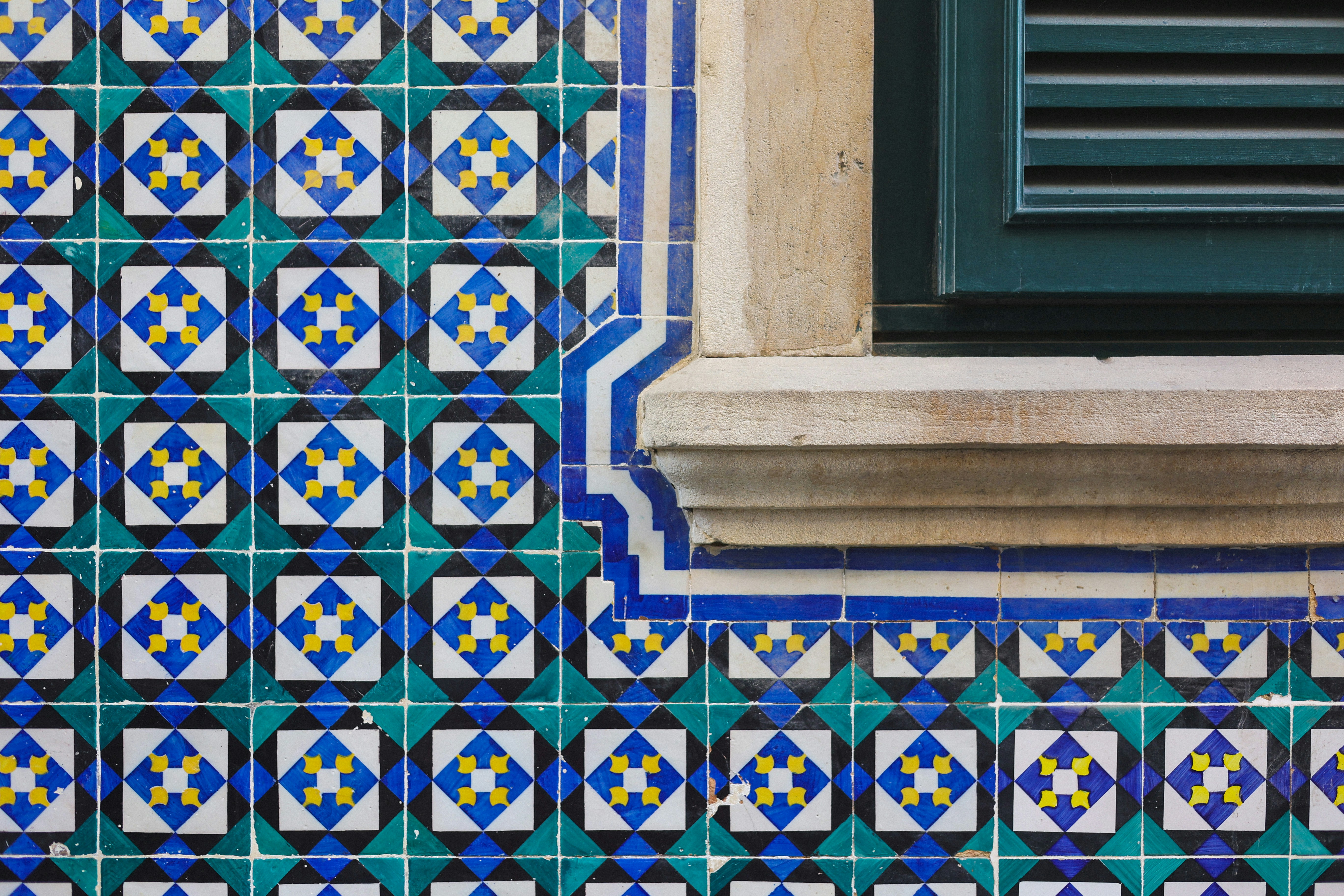 Framed Azulejo Mosaic: The Windowed Edge of a Blue-Gold Tile Quilt