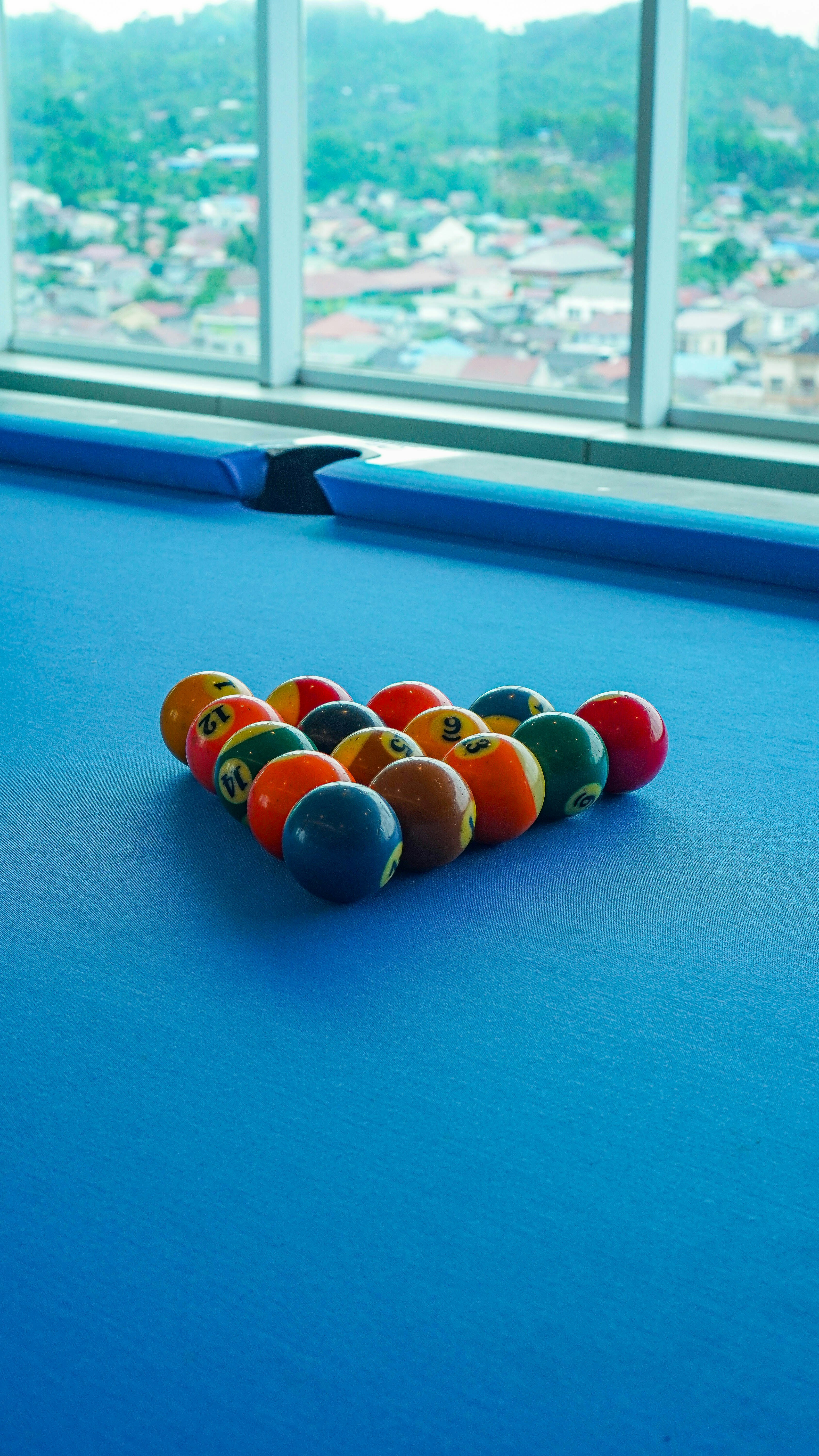 Triangle of Color on Blue Felt: Billiard Balls Rest in Quiet Focus