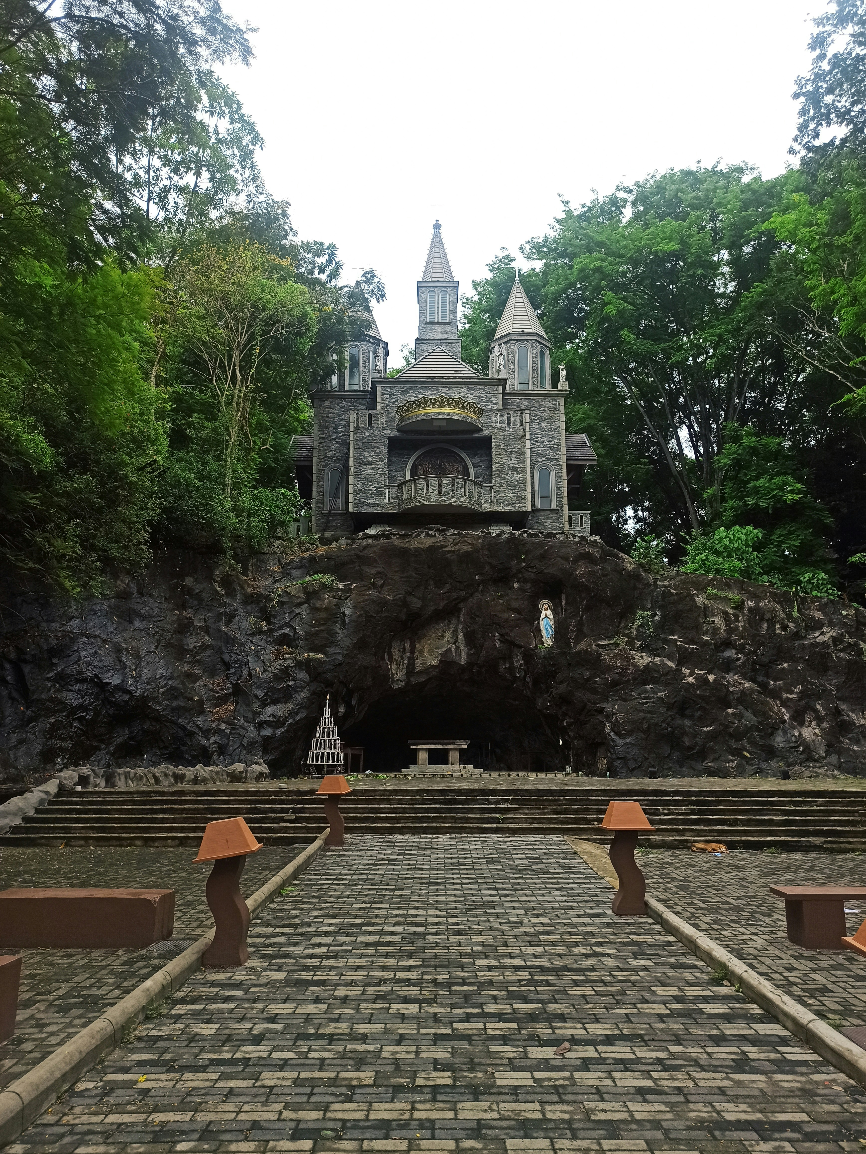 A large building with a clock tower on top of it photo – Free Thewatta national basilica of our ...