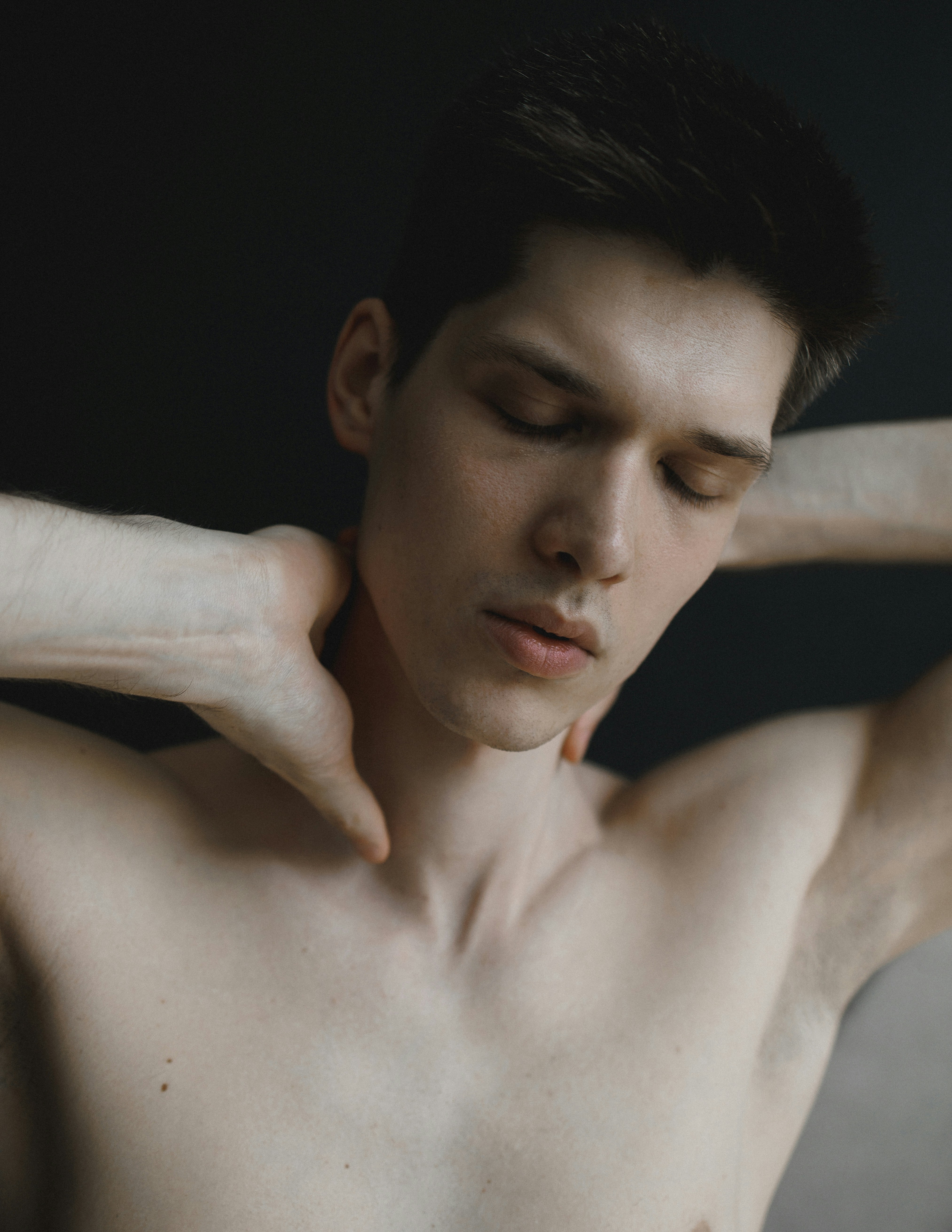 A shirtless man is holding his hands on his neck photo – Free Portrait ...
