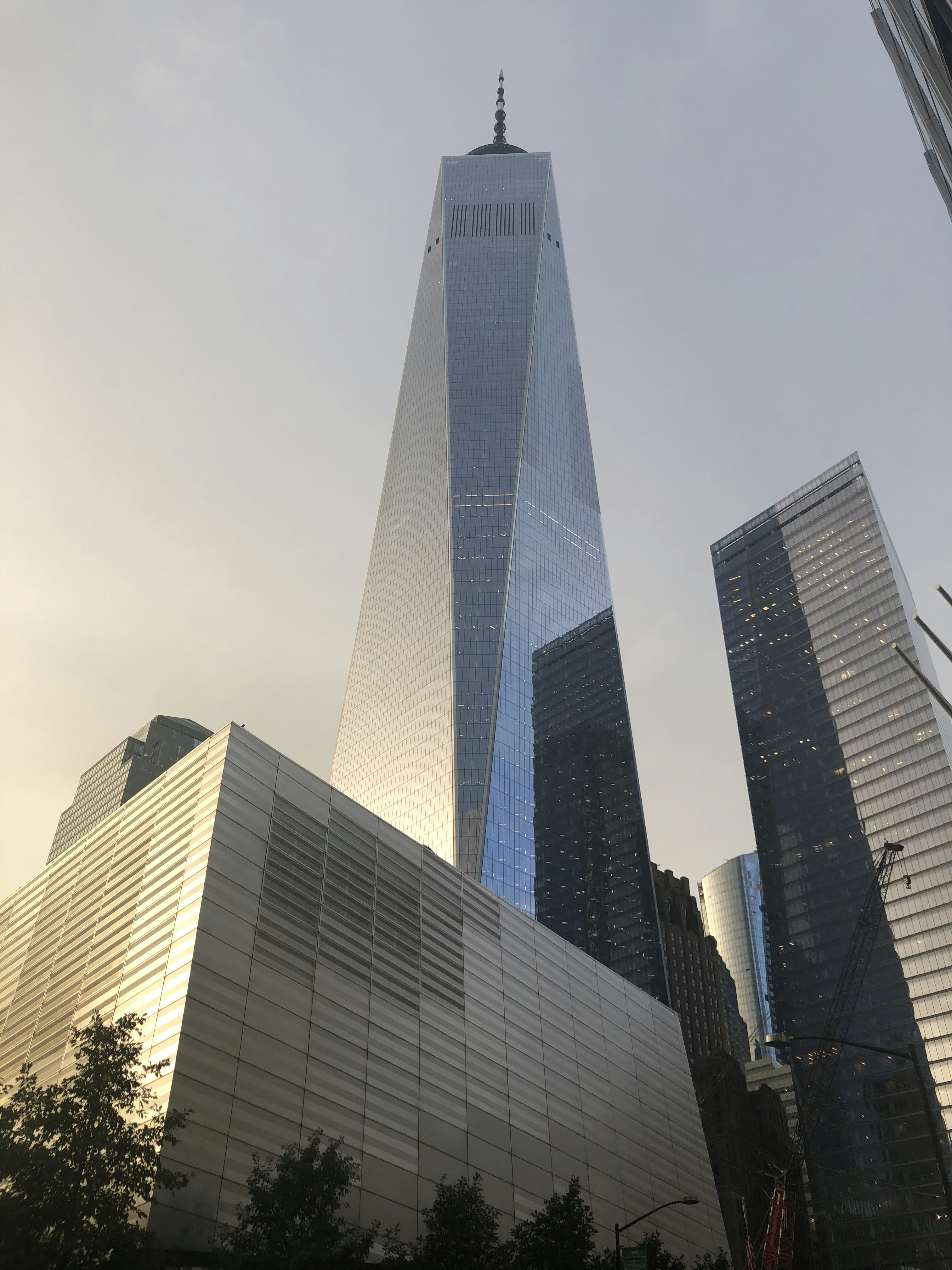 A very tall building towering over a city photo – Free Image on Unsplash