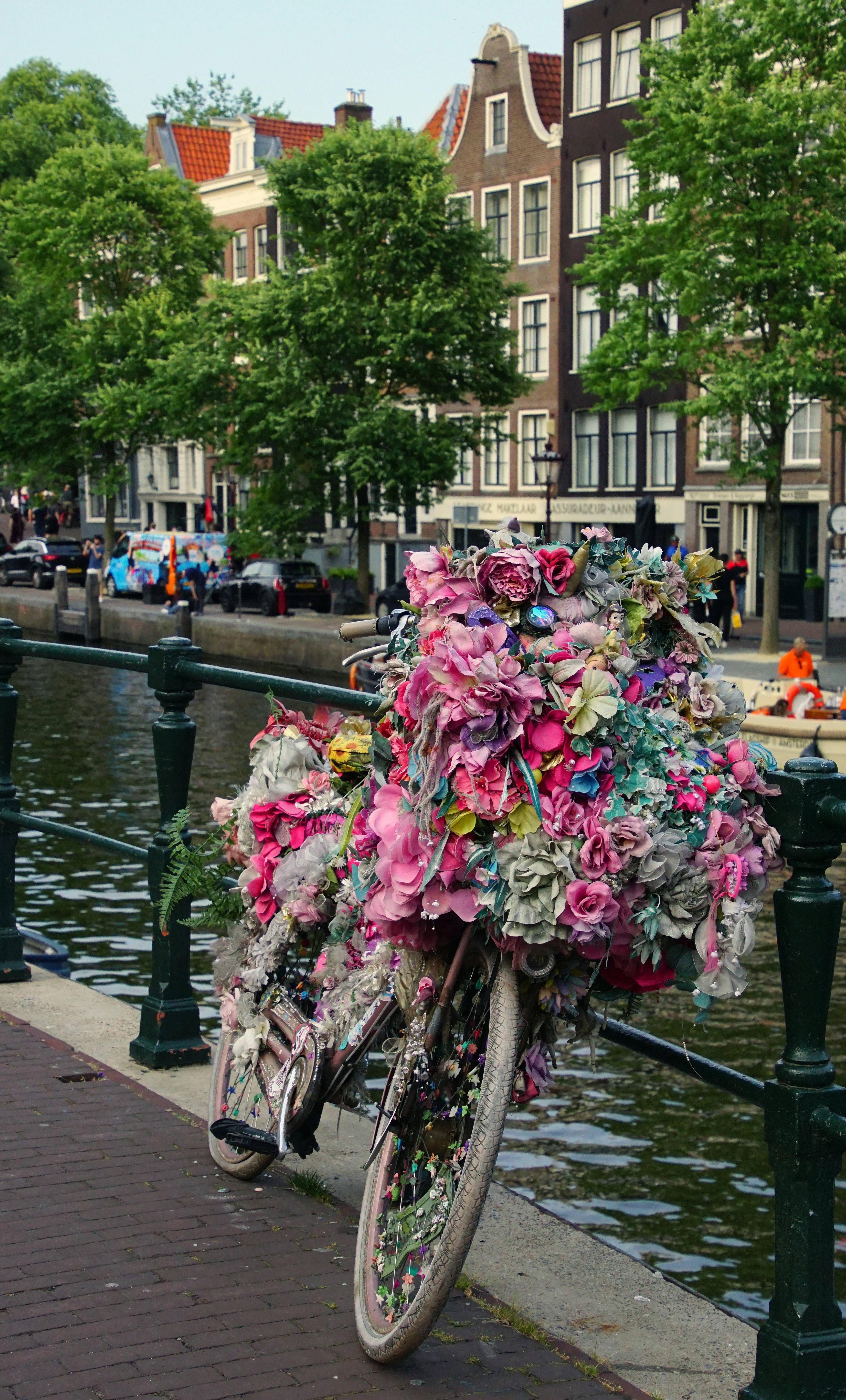 A flower bicycle beside a canal in Amsterdam, Holland.