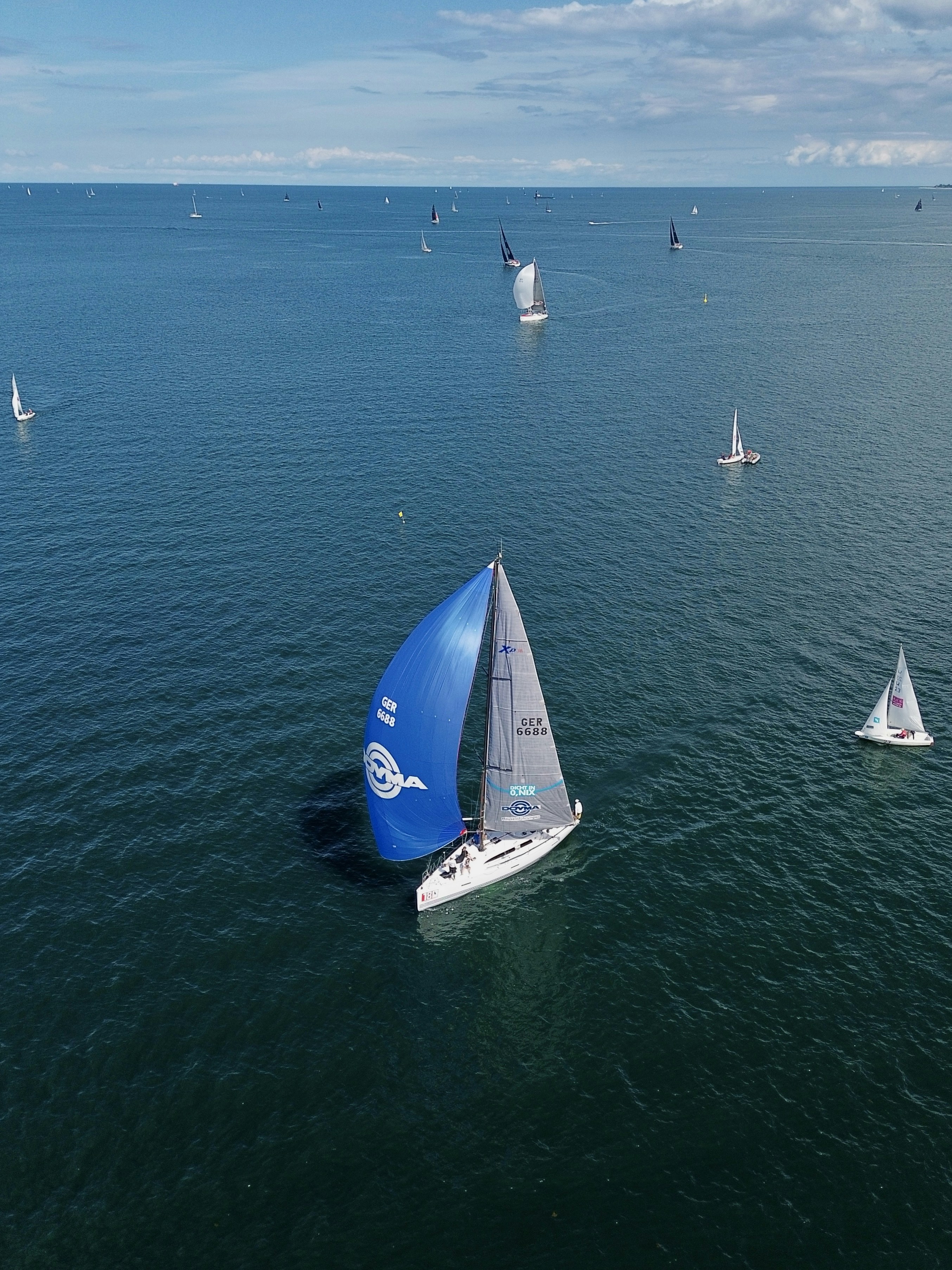 A group of sailboats sailing on a large body of water photo – Free Kiel ...