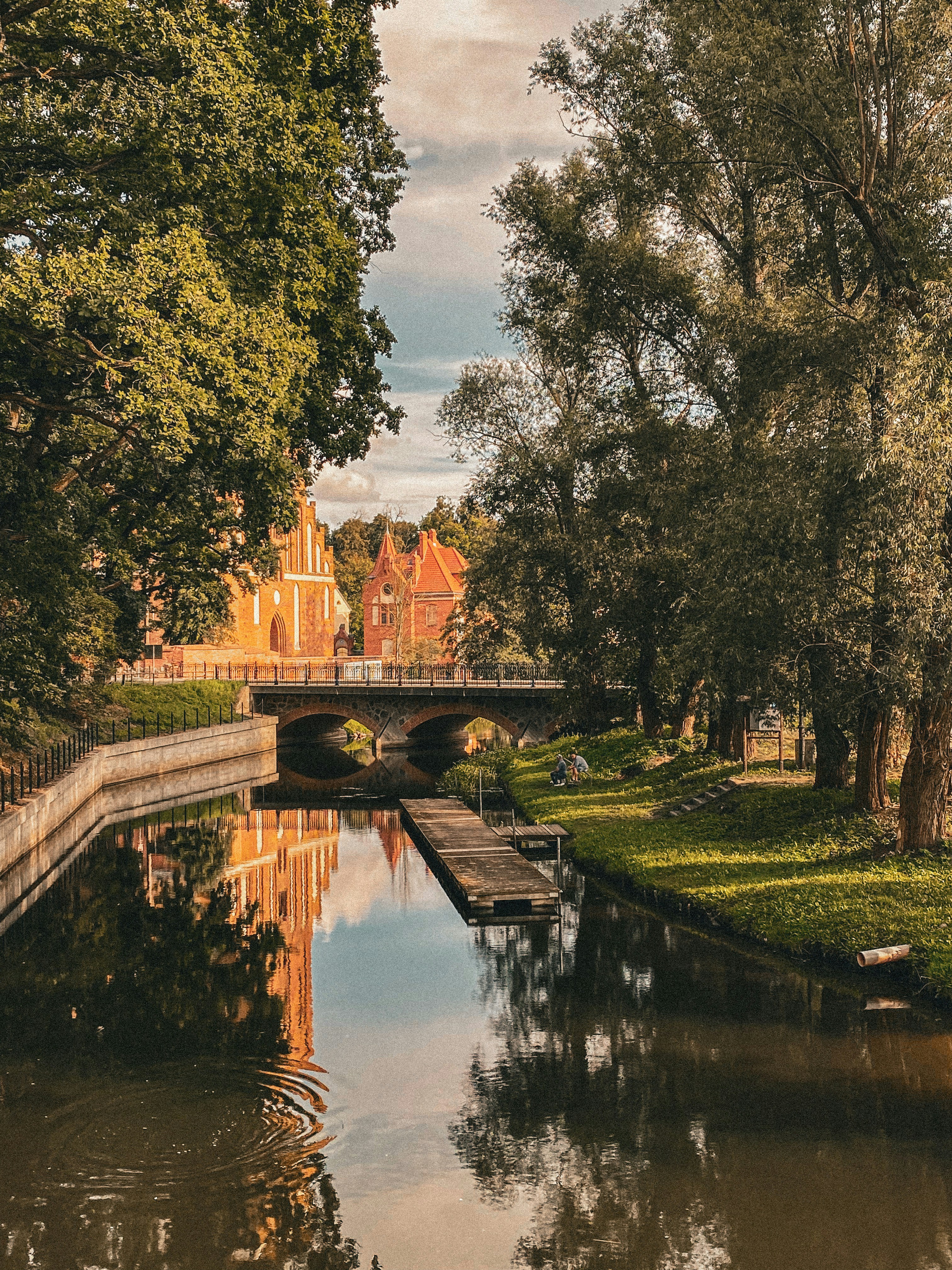 Golden Hour Bridge Over a Quiet Canal with Reflections