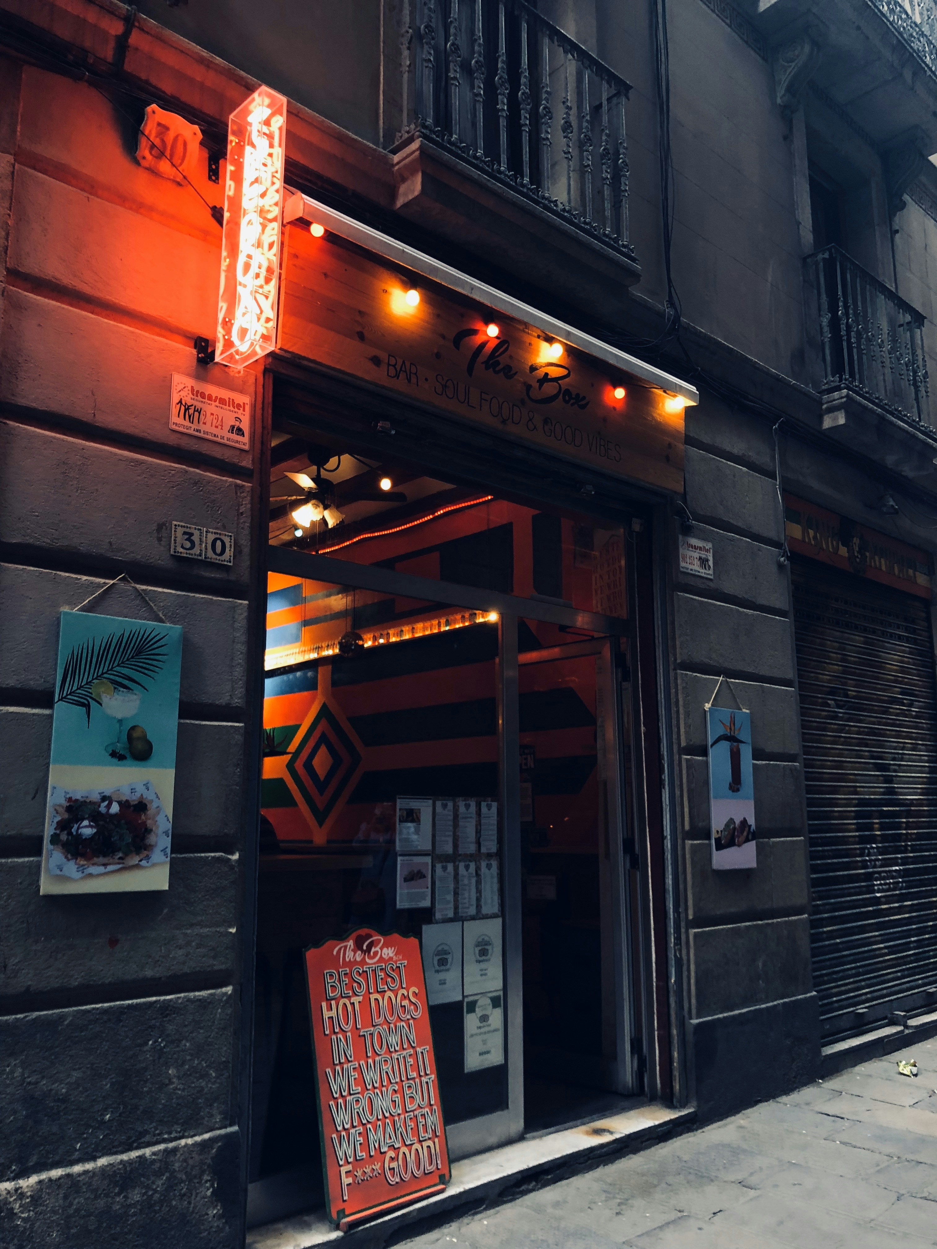 Neon Threshold: A Striped Interior Revealed Through an Open Entrance